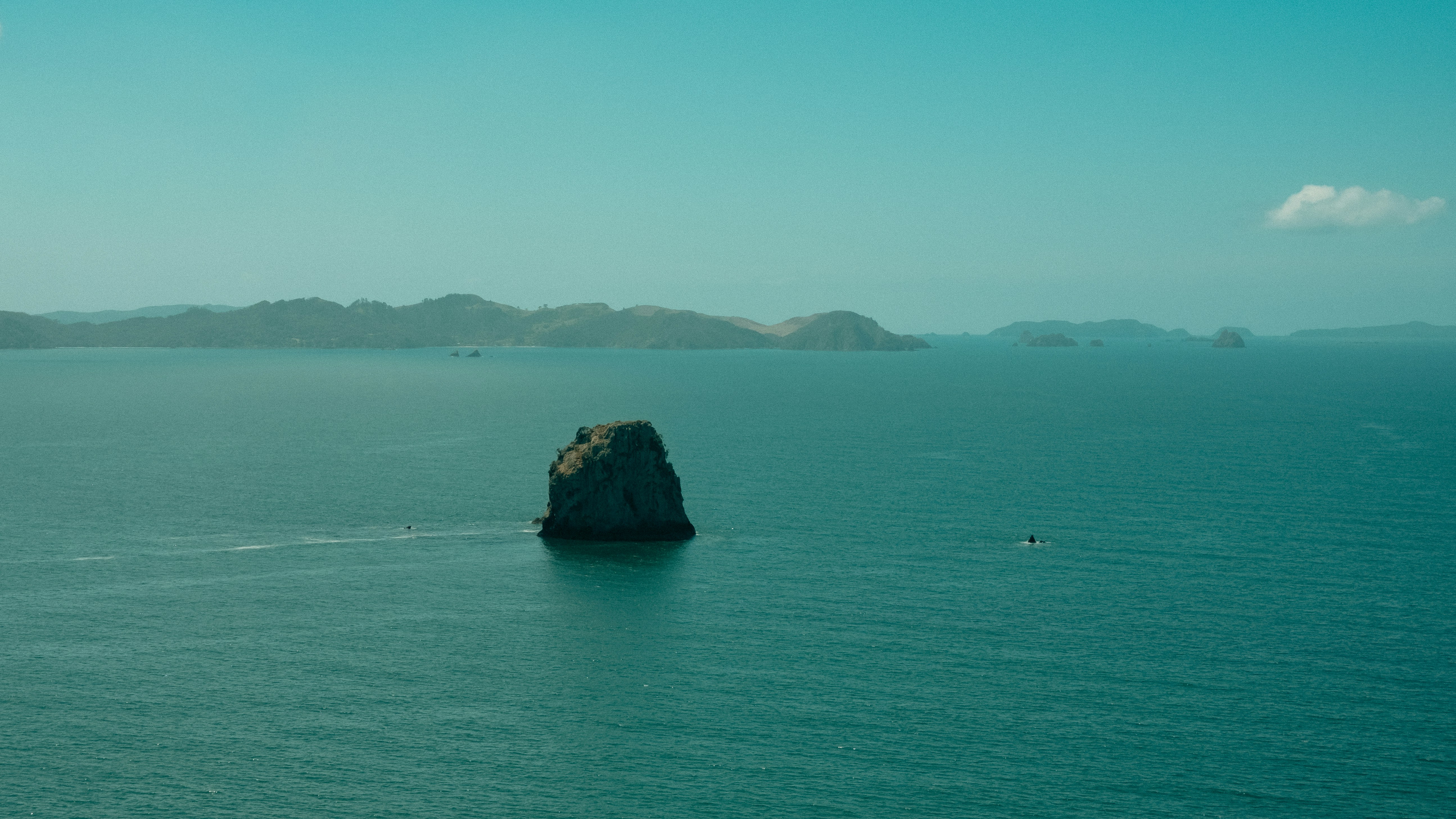 Solitary Rock: A Quiet Break in Azure Horizon