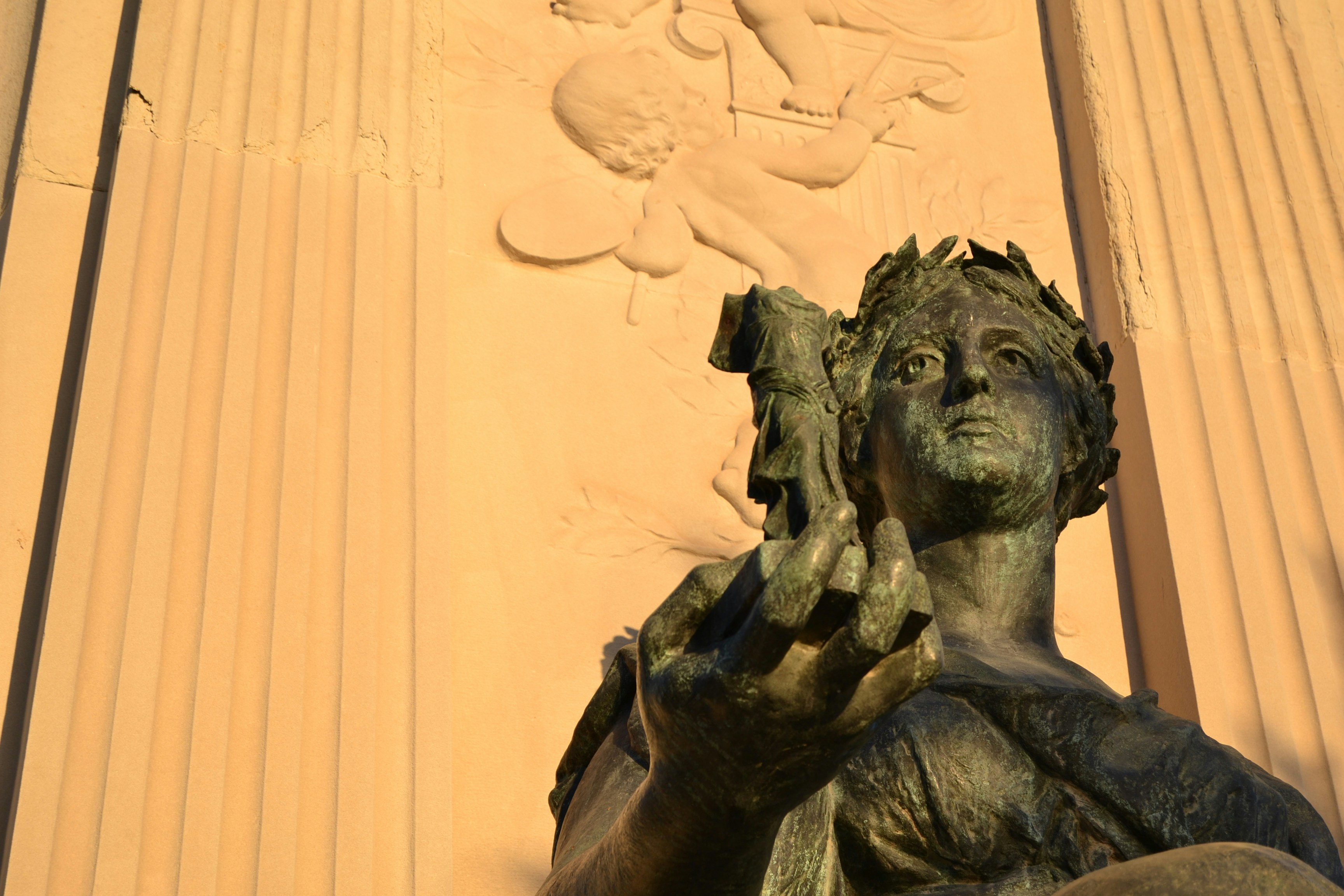 Sculpted Reach: A Bronze Embrace Reaching Toward the Viewer