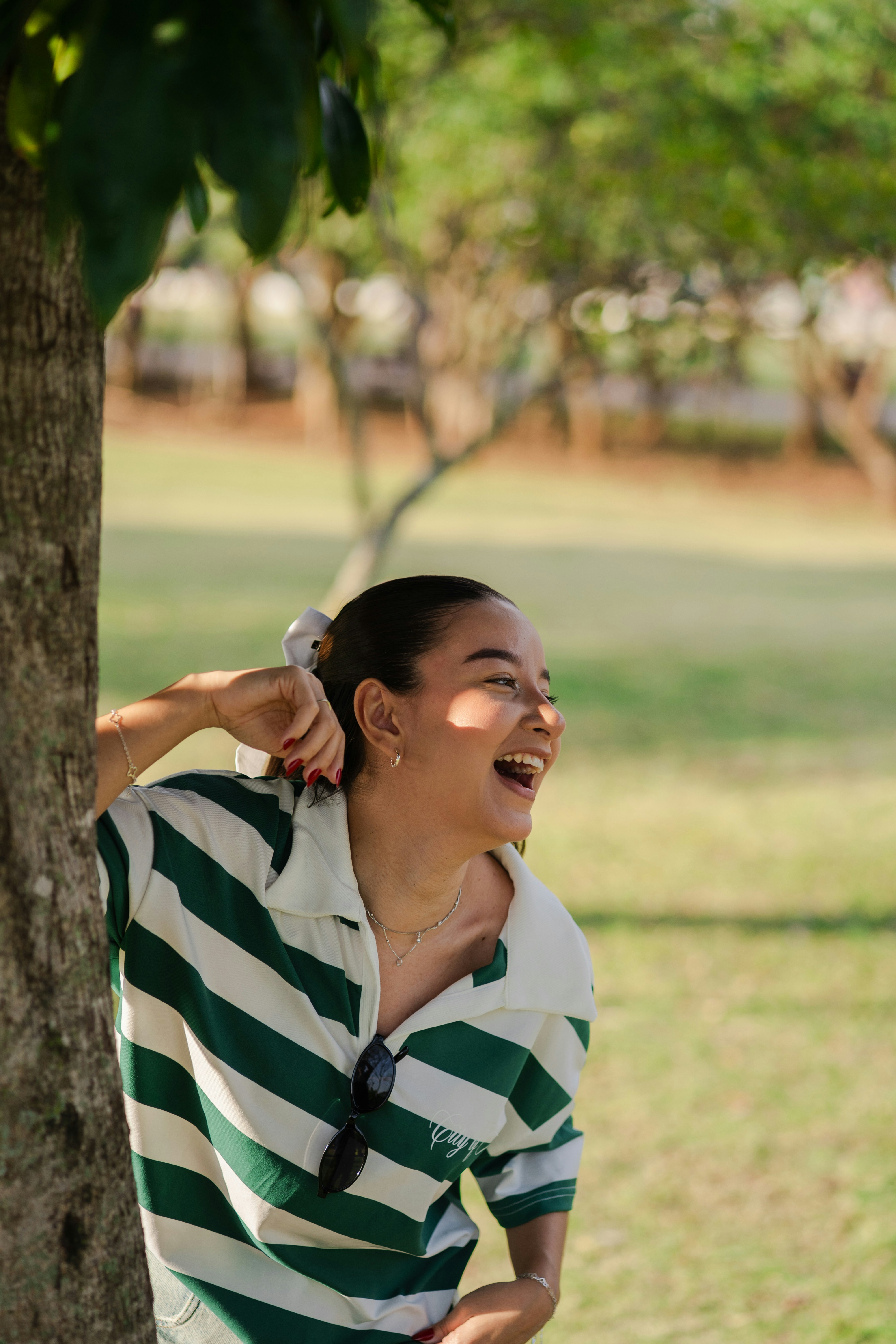 Laughing in the Shade: A Green-and-White Stripe Moment