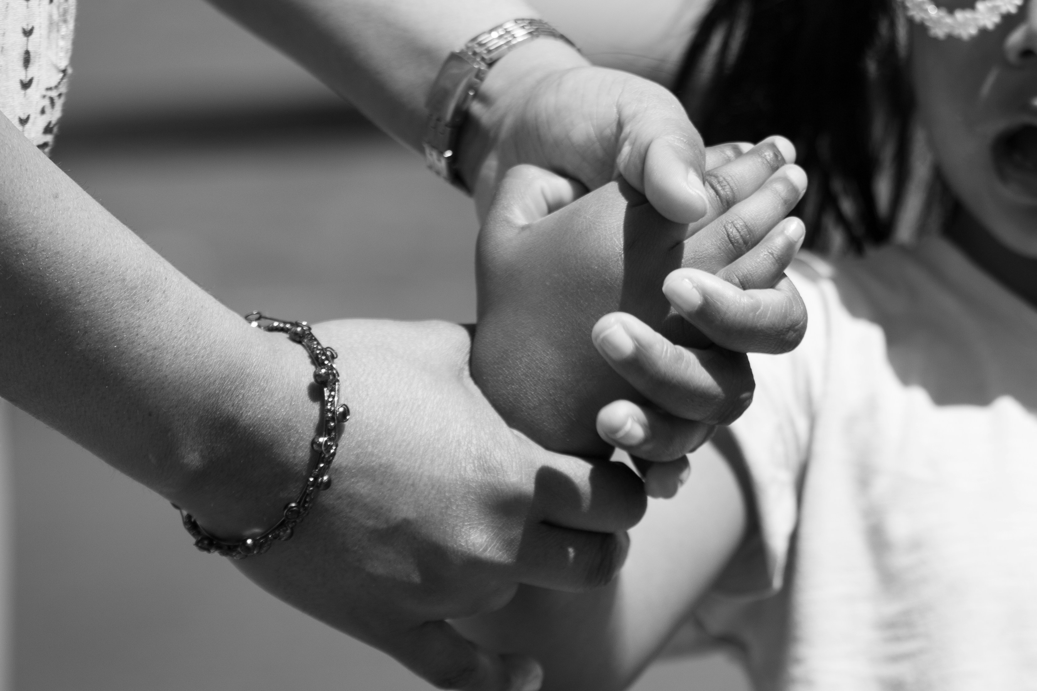 Hands in Harmony: A Shared Bond in Close-Up Black‑and‑White
