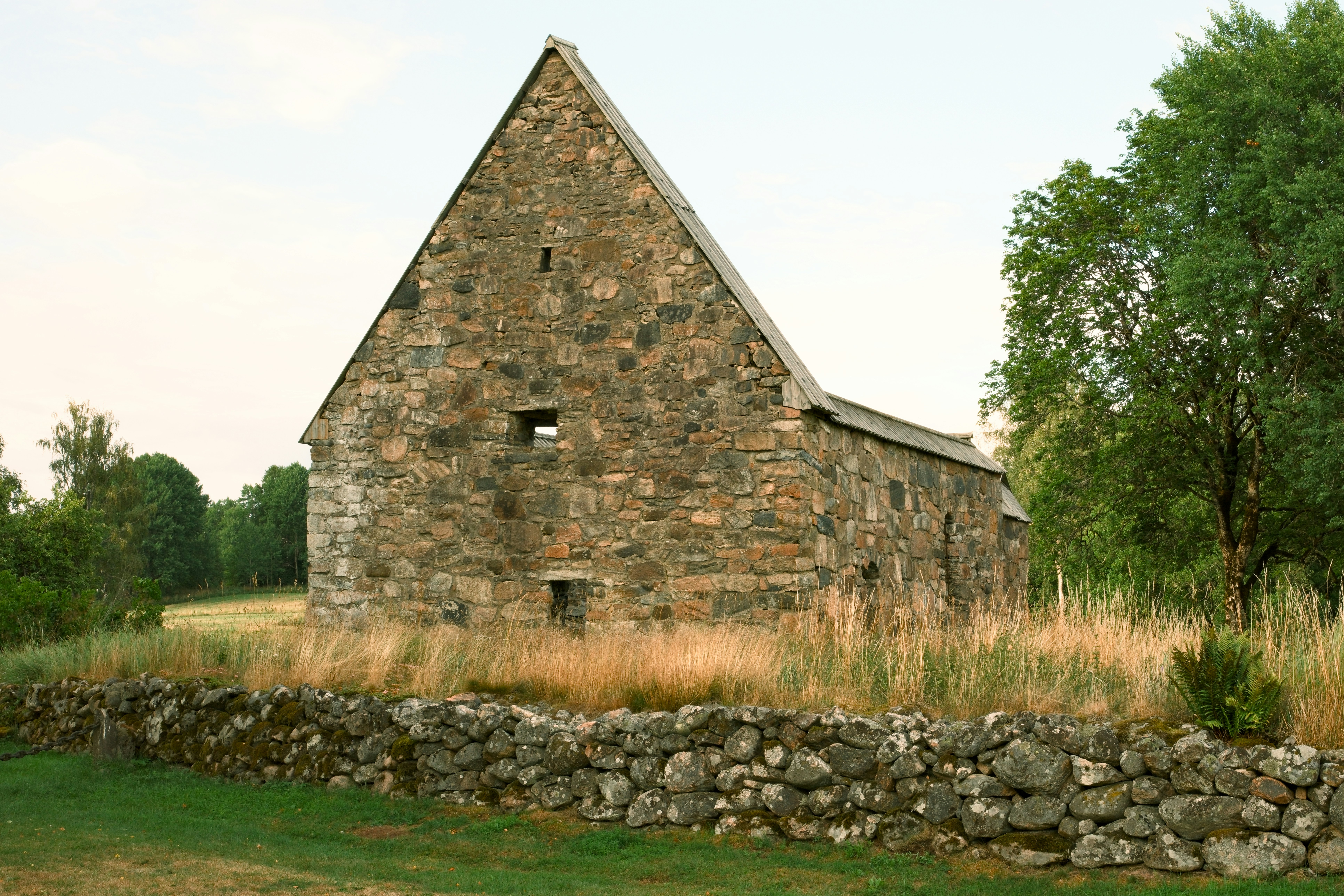 Stone Barn in Open Field: Silent Fieldstone at Dusk