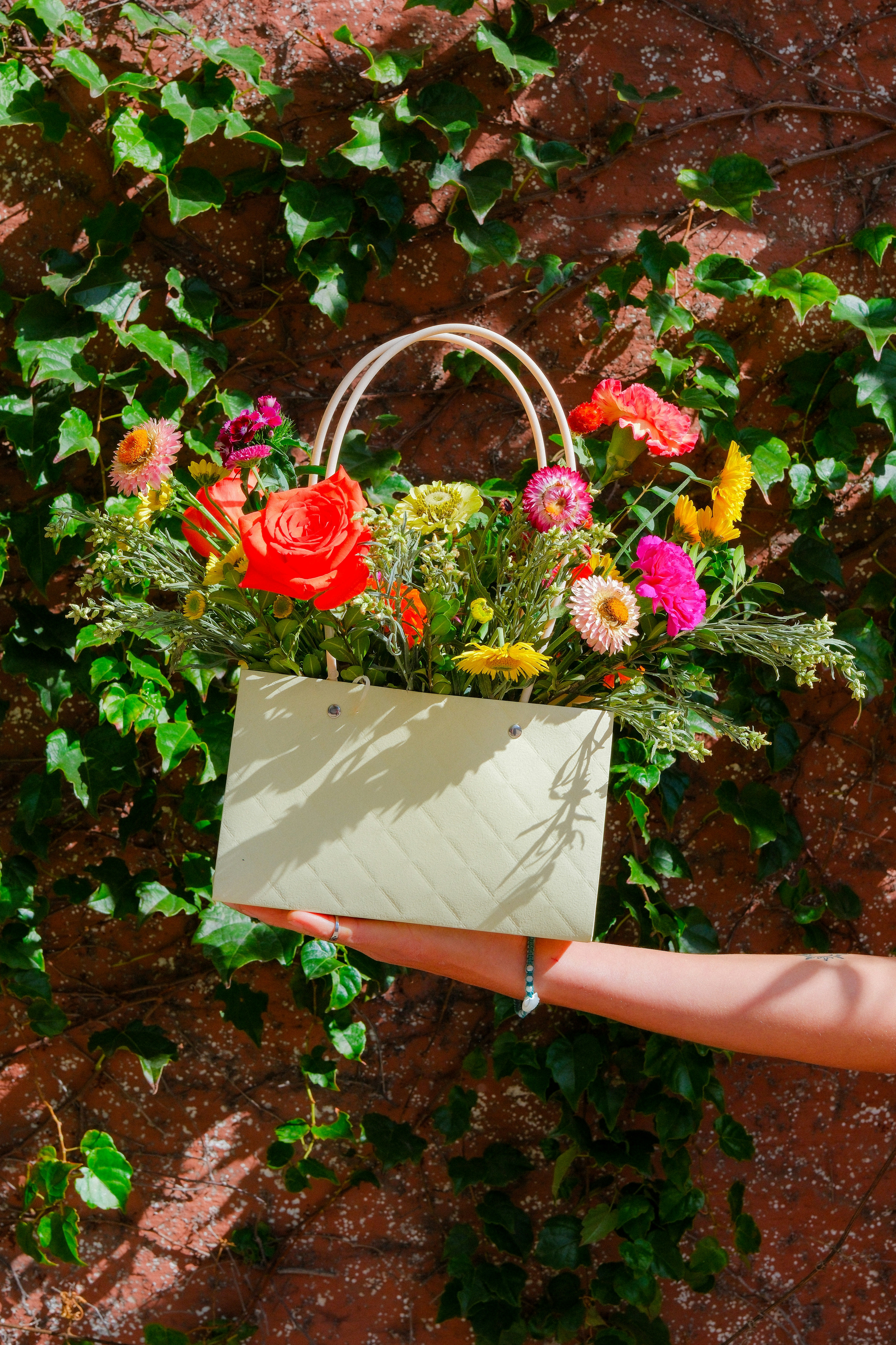 Bouquet in the Sun: A Handed-Over Blooms Moment