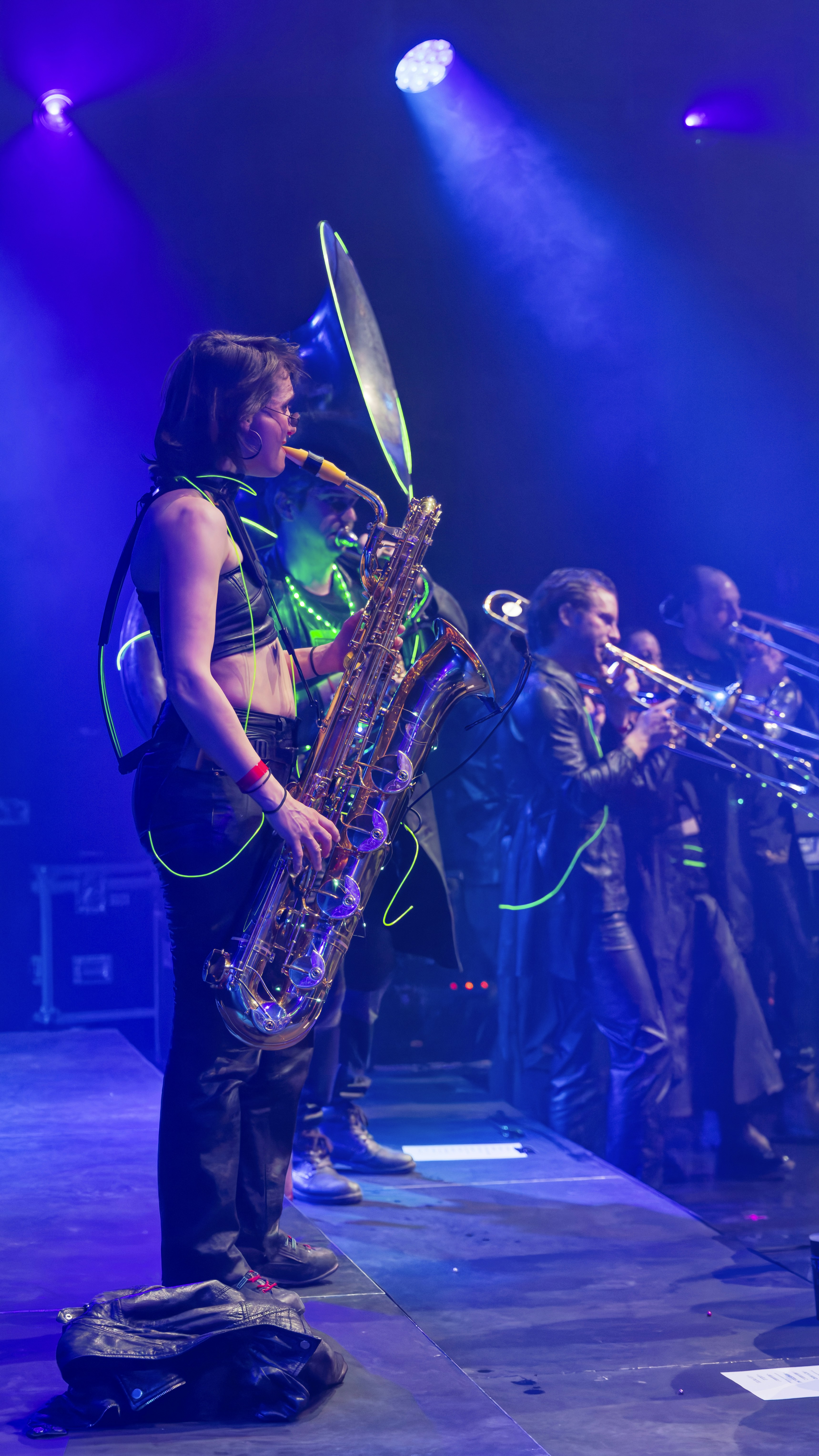 Saxophonist in neon-lit lineup takes the stage