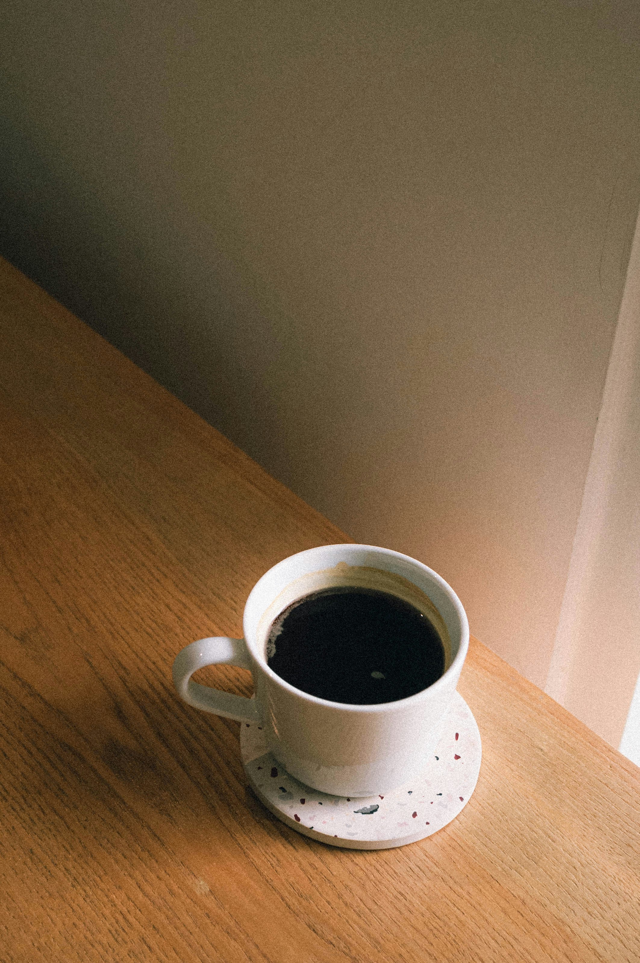 Center Cup: Minimalist Morning Coffee on a Wooden Table