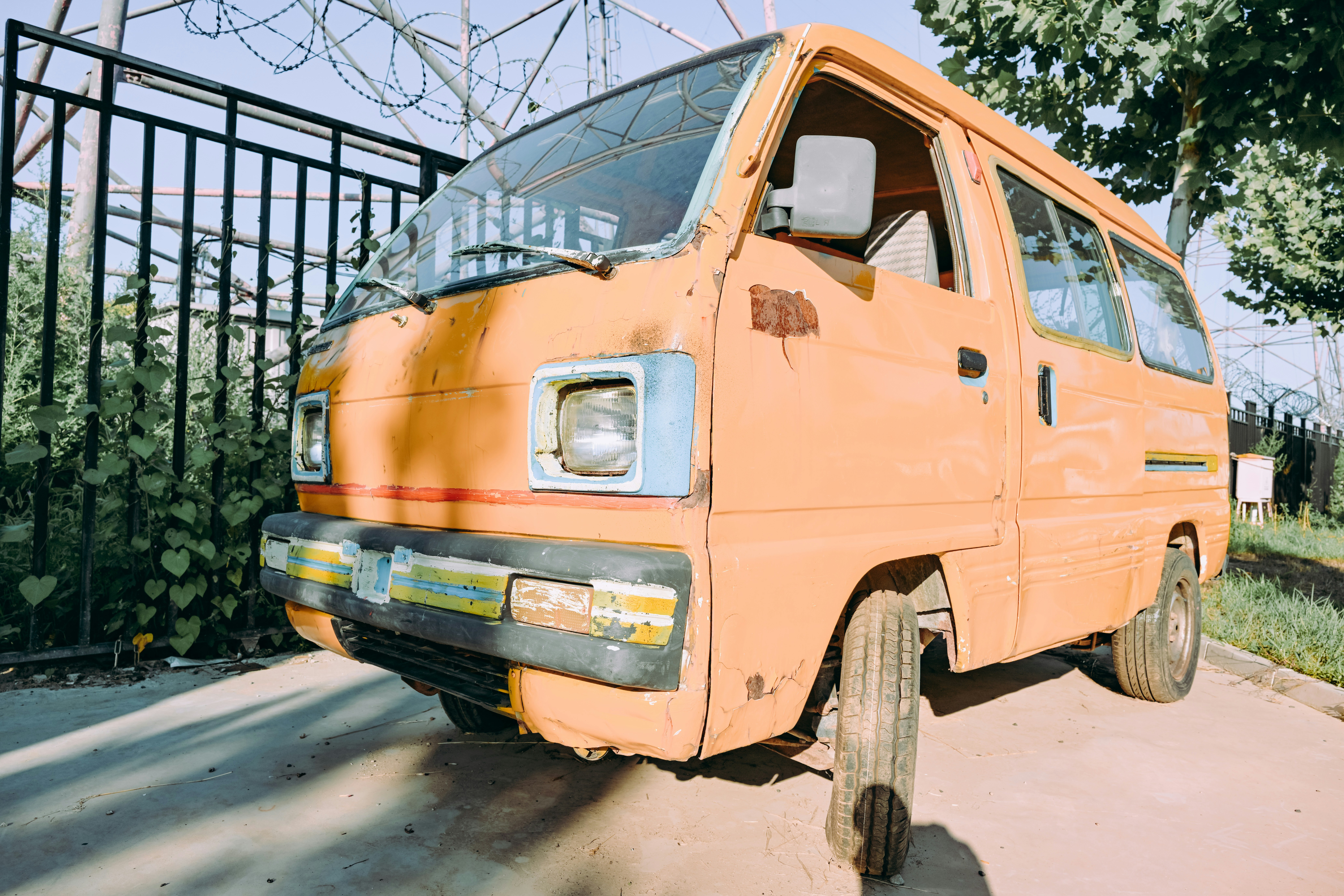 Orange Shabby Van in a Quiet Fenced Lot