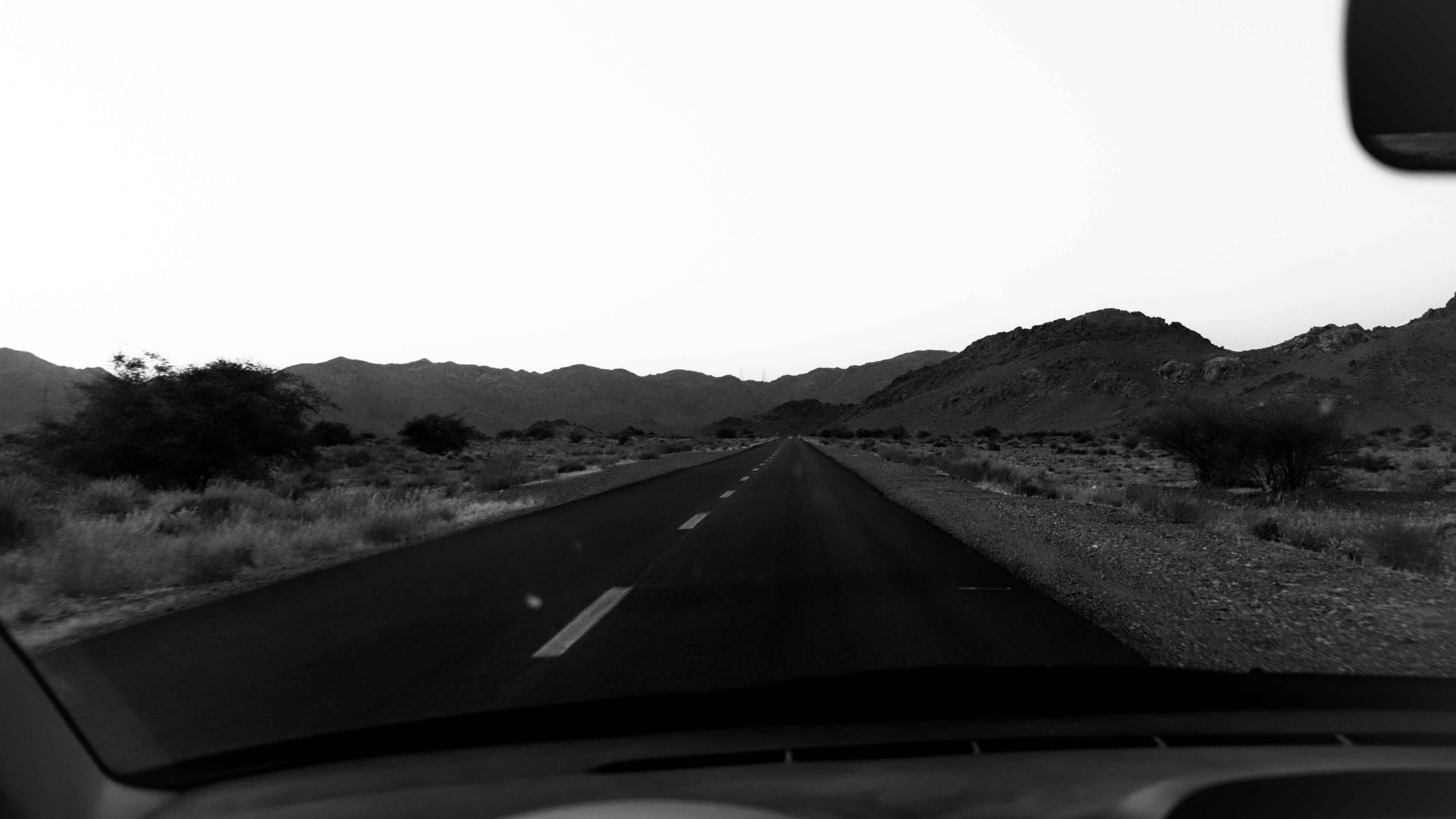 Desert Highway Veil: A Monochrome Dawn Venture