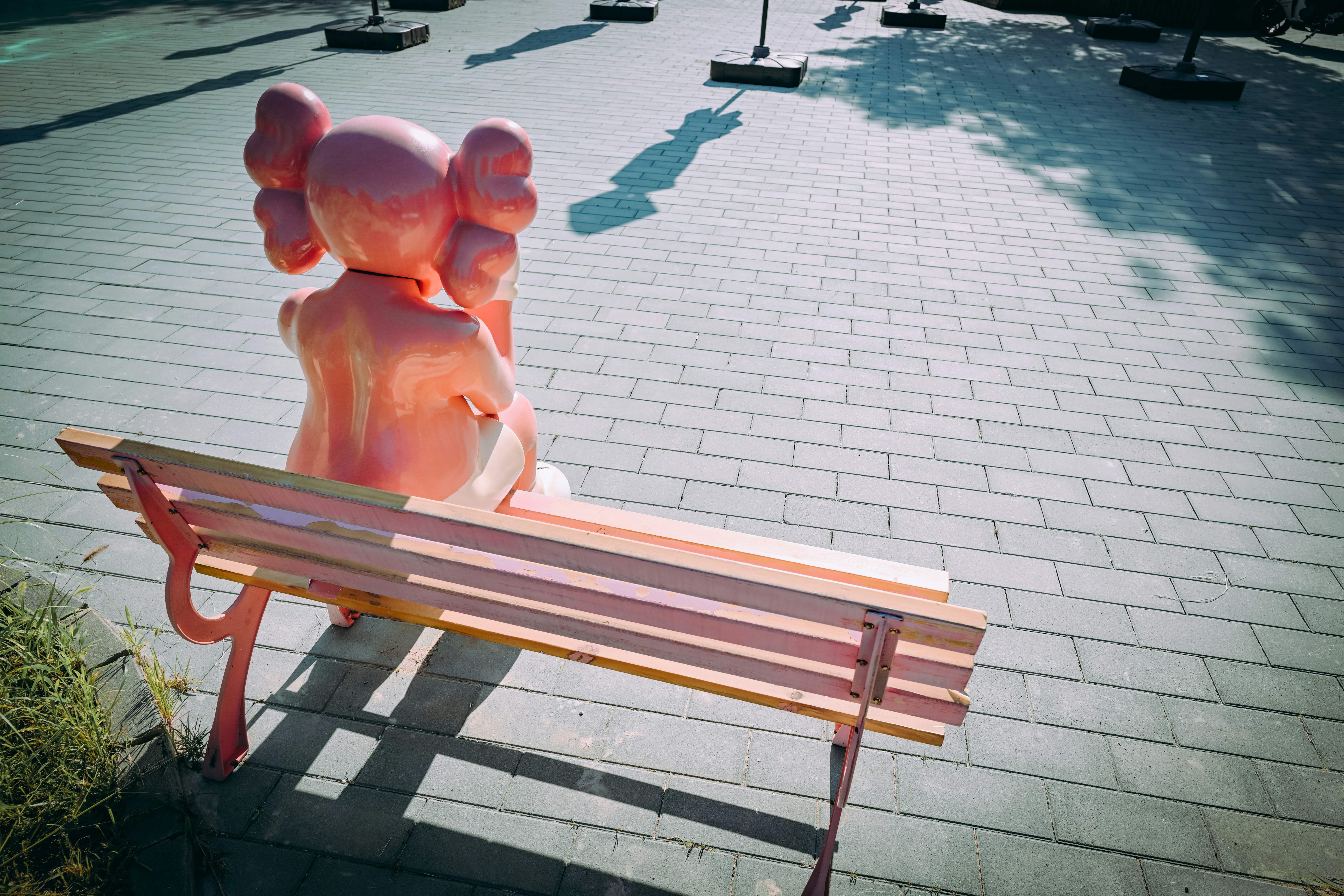 Pastel Bench Guardian: A Quiet Disney-esque Moment in the Park