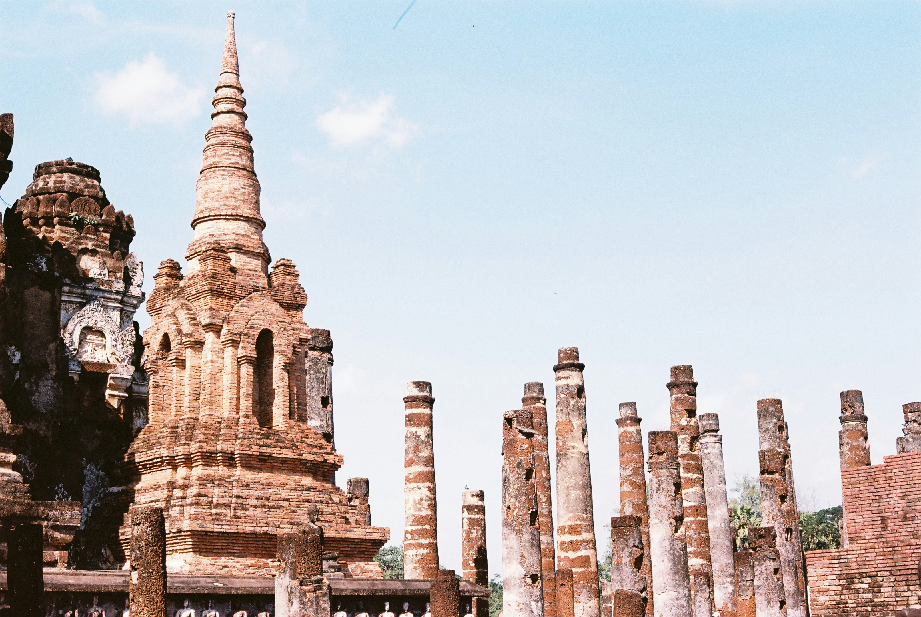 Rising Spires of Time: Ancient Ruins Against a Bright Sky