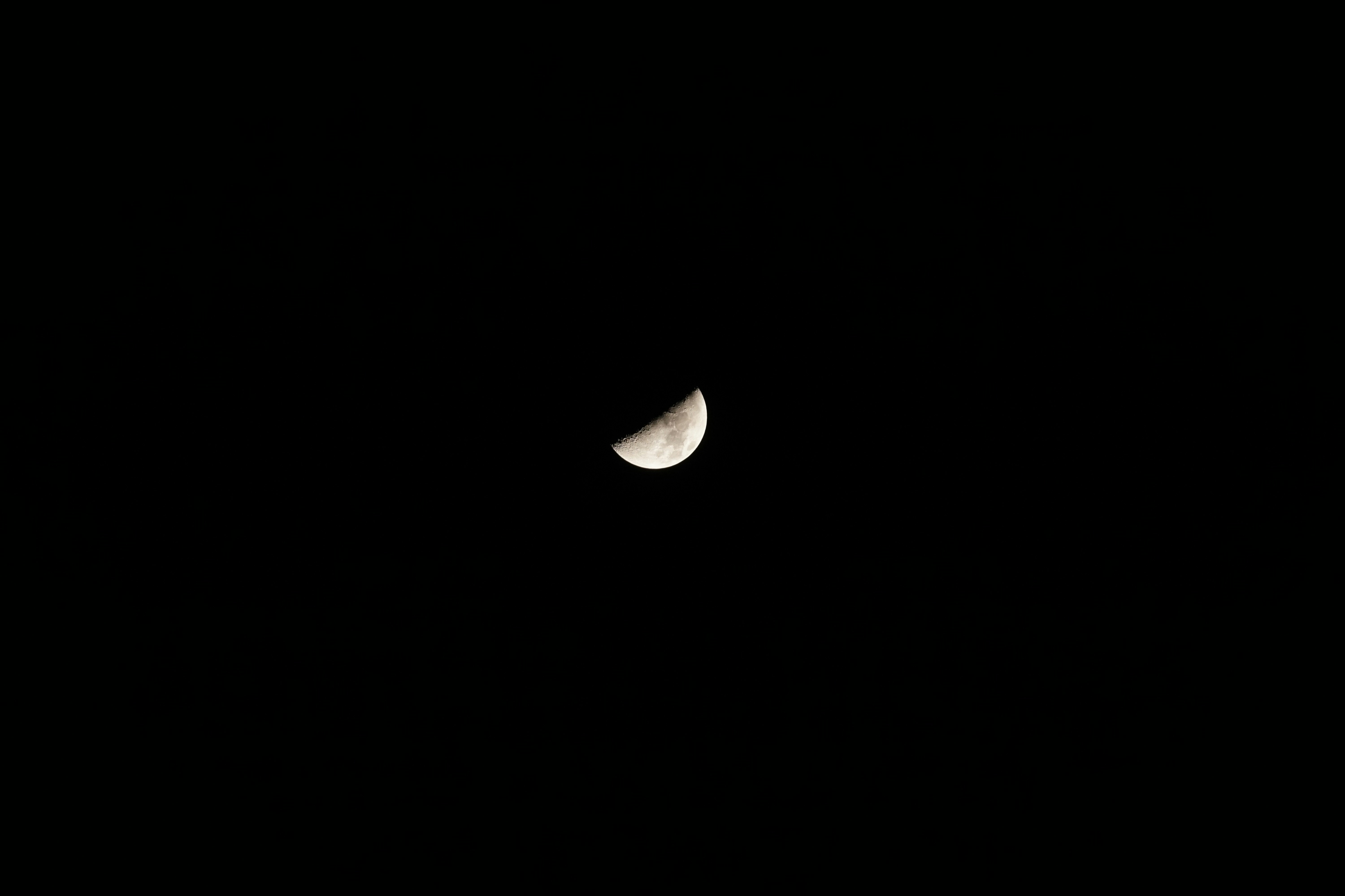 Moonlit Sliver: A Quiet Crescent in Night’s Void