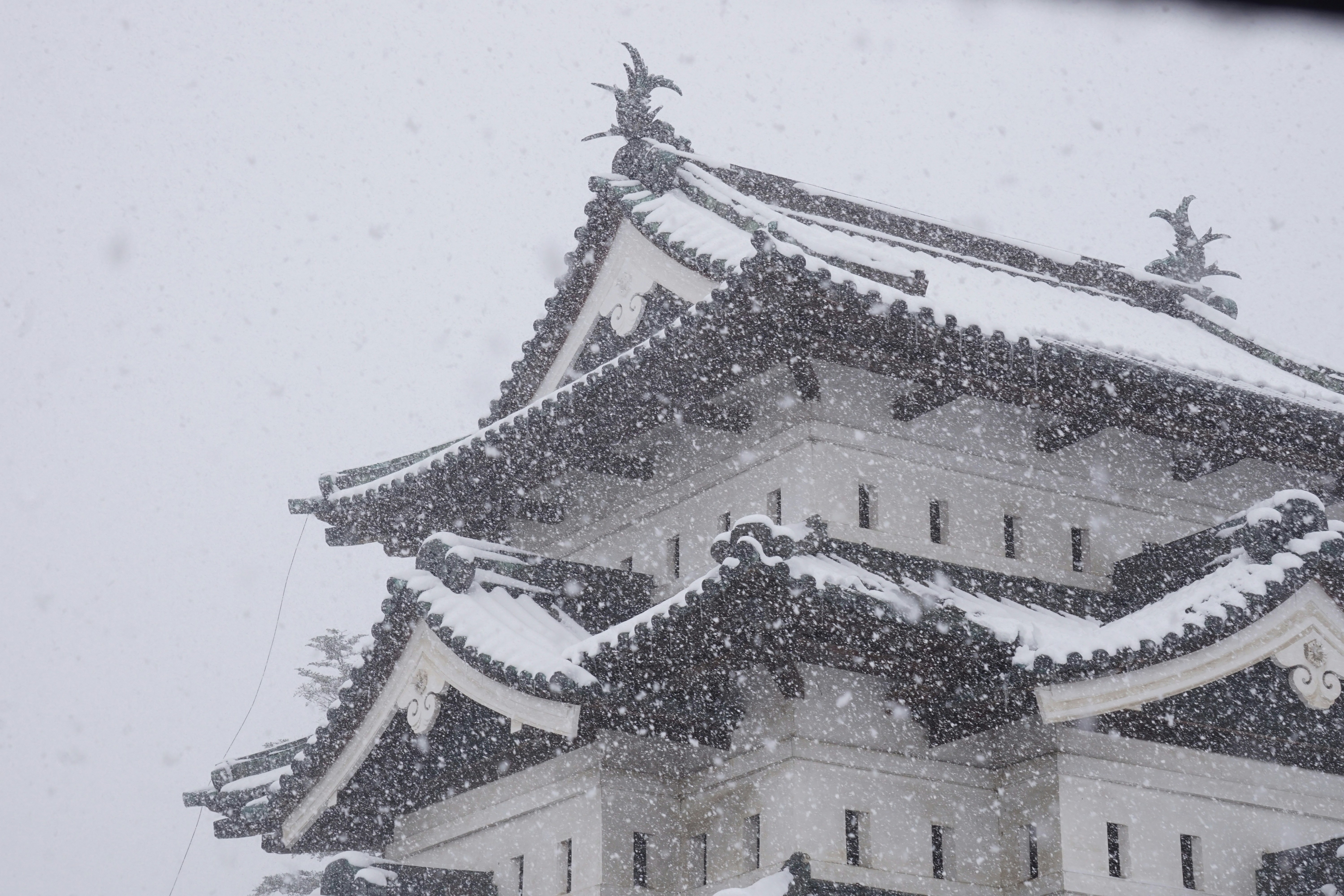 Snowfall over a Silent Japanese Castle Rooftop
