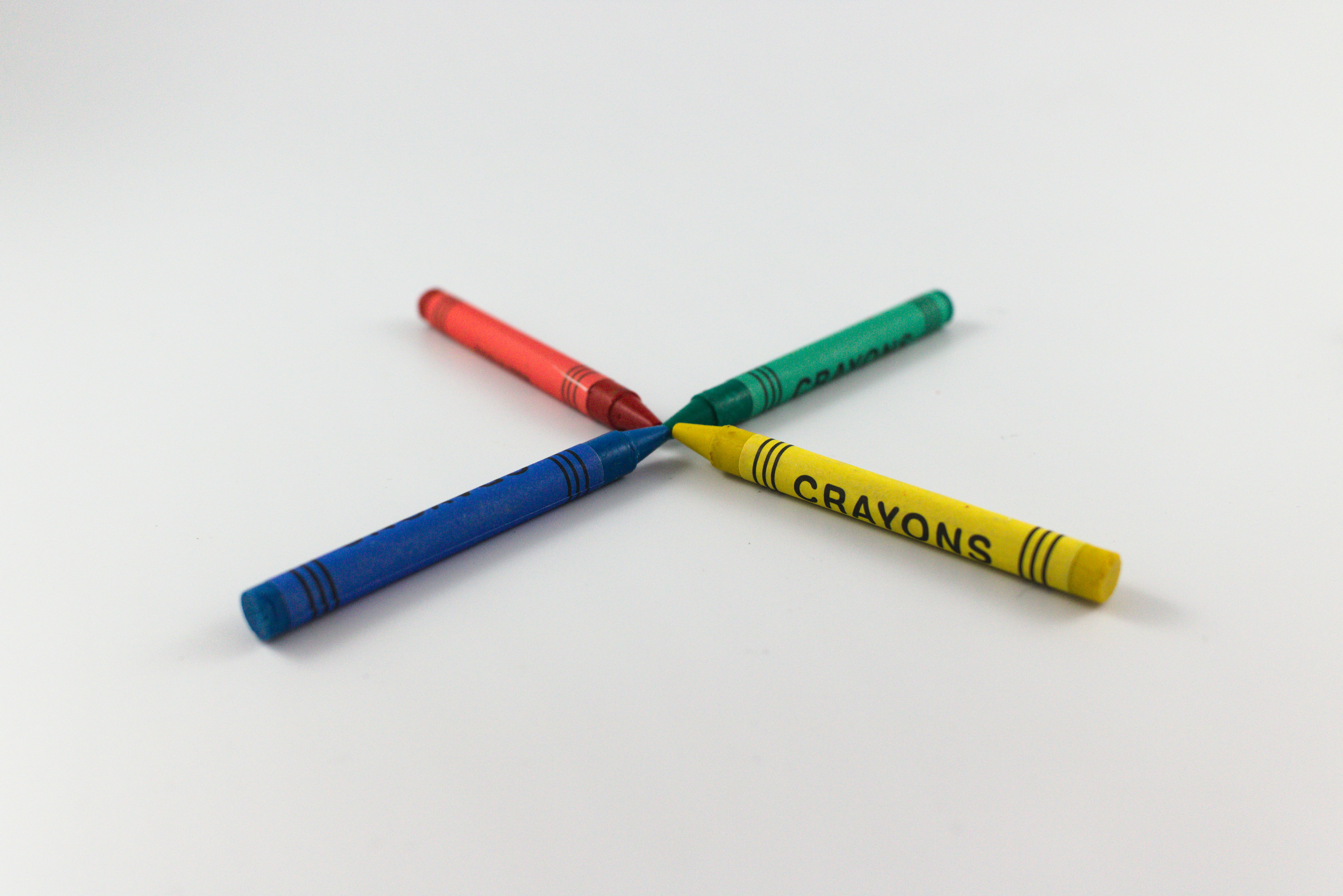 4 crayons,. Blue, Red, Yellow, Green.