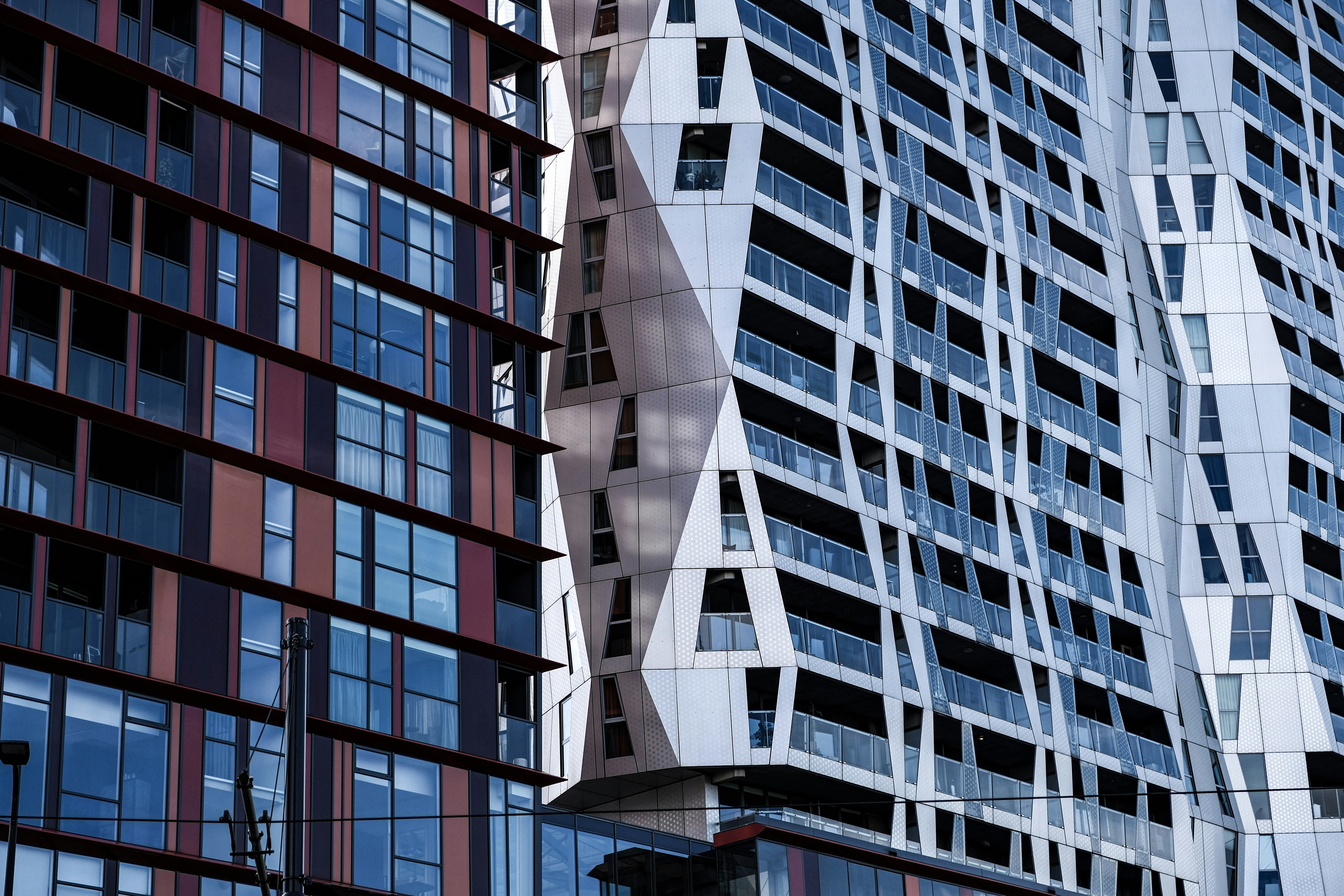Architectural Duet: Fractured Facades in Parallel Steel