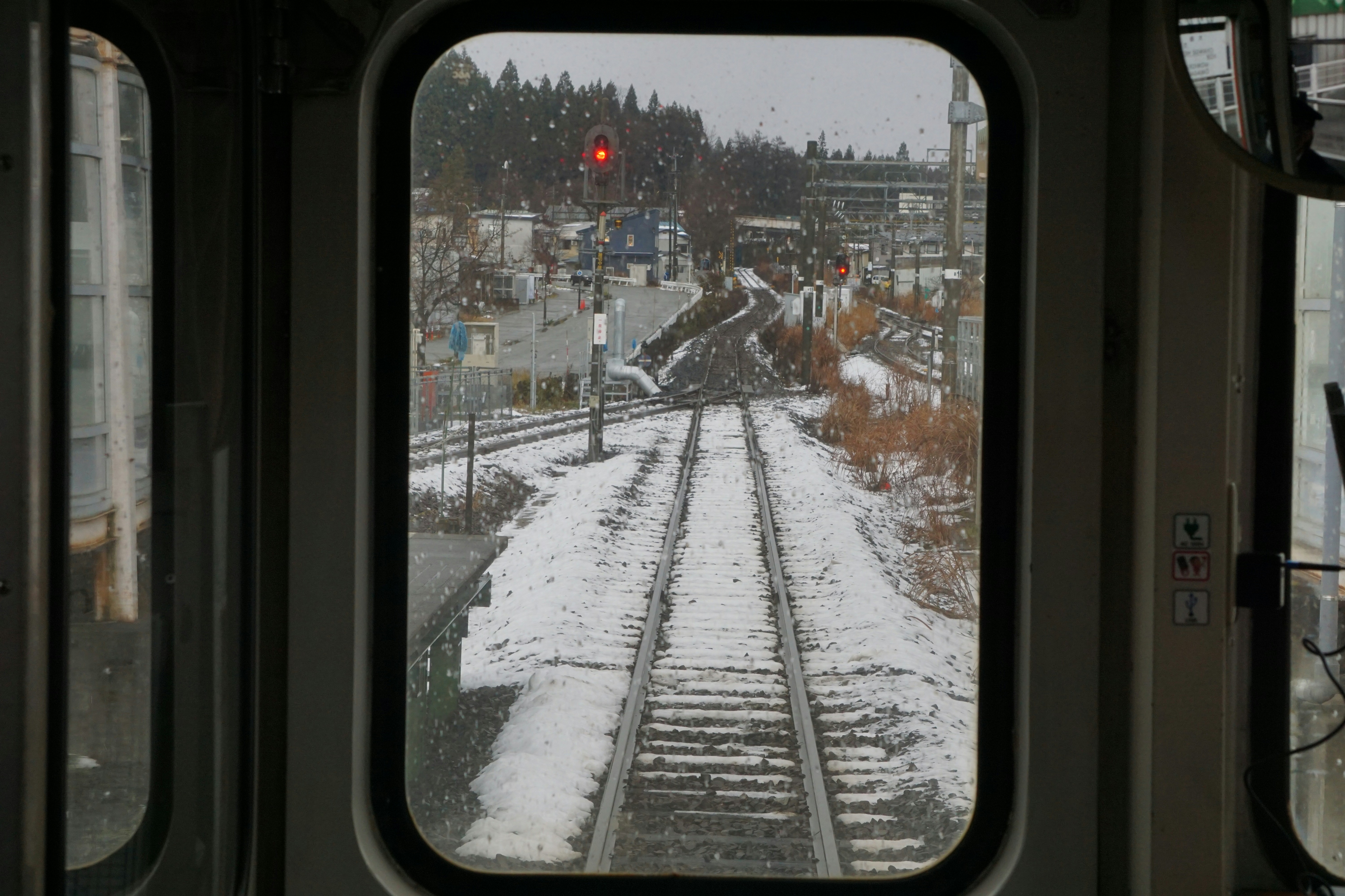 Through the Snow-Cleared Rails: A Forward View from the Car Door