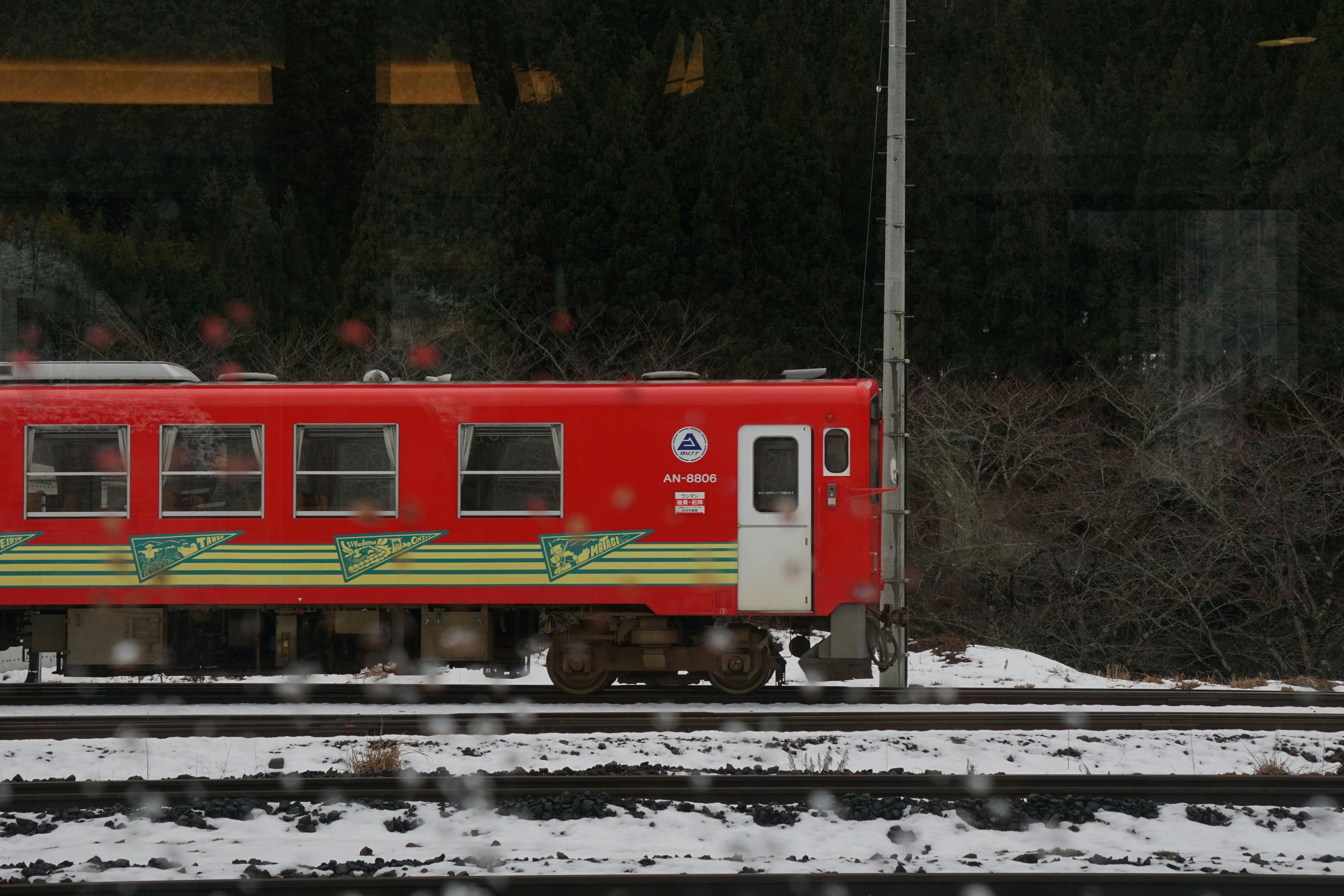Red Railer in Snow: A Quiet Moment on a Cold Track