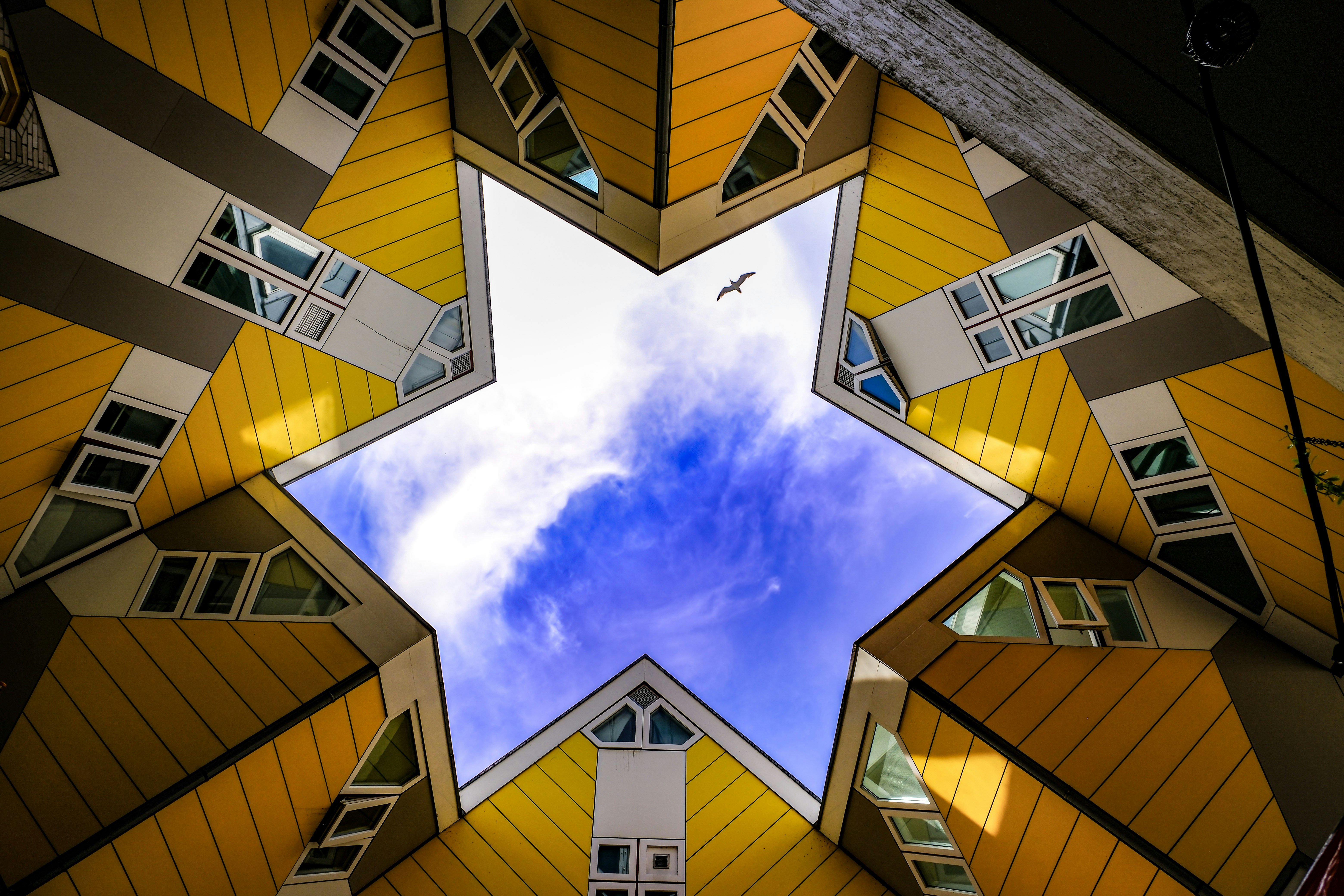Sky Through the Hexagon: A Bird’s-Eye Moment Inside a Golden Courtyard