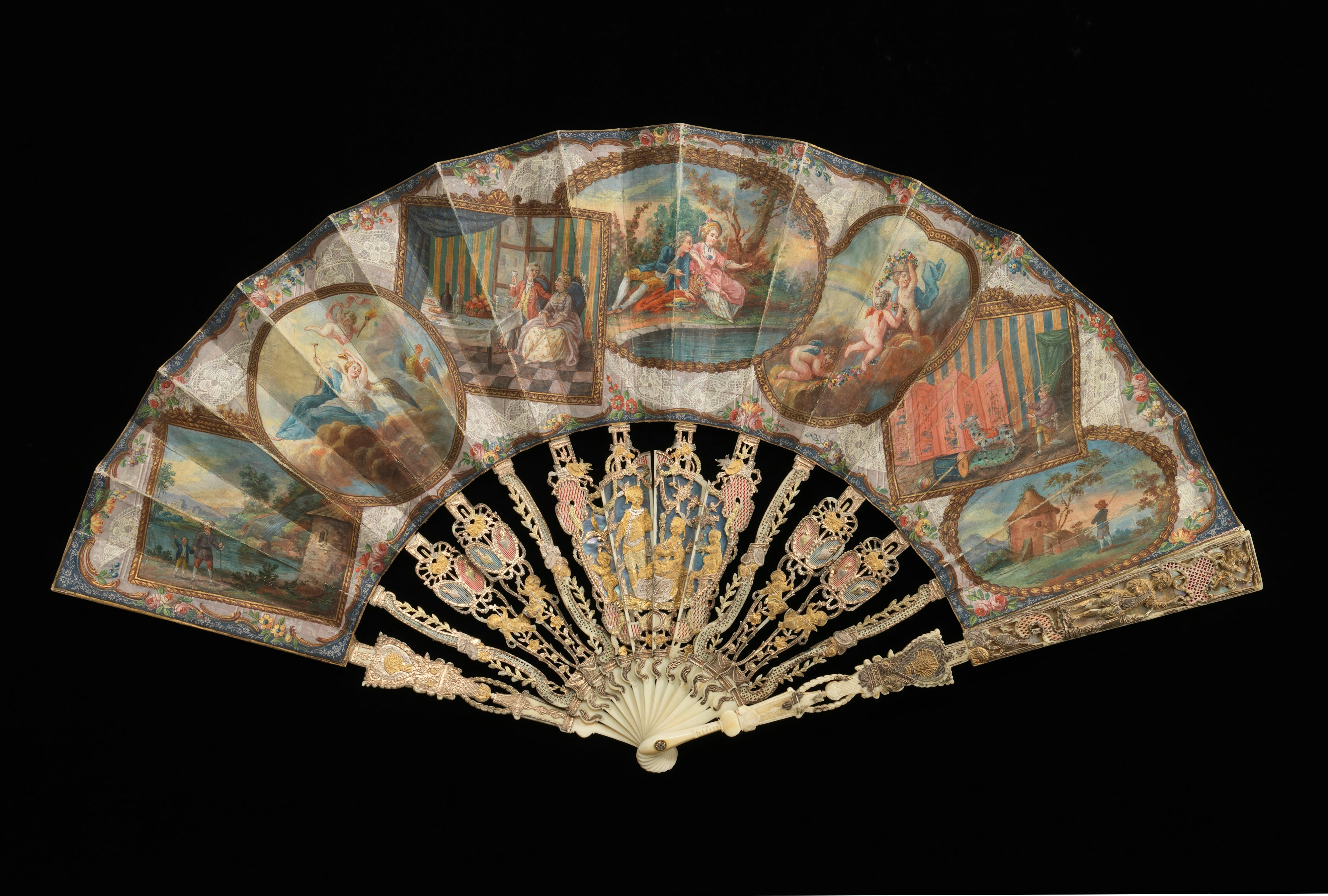 Ornate Painted Fan Unfolded Against Velvet Darkness