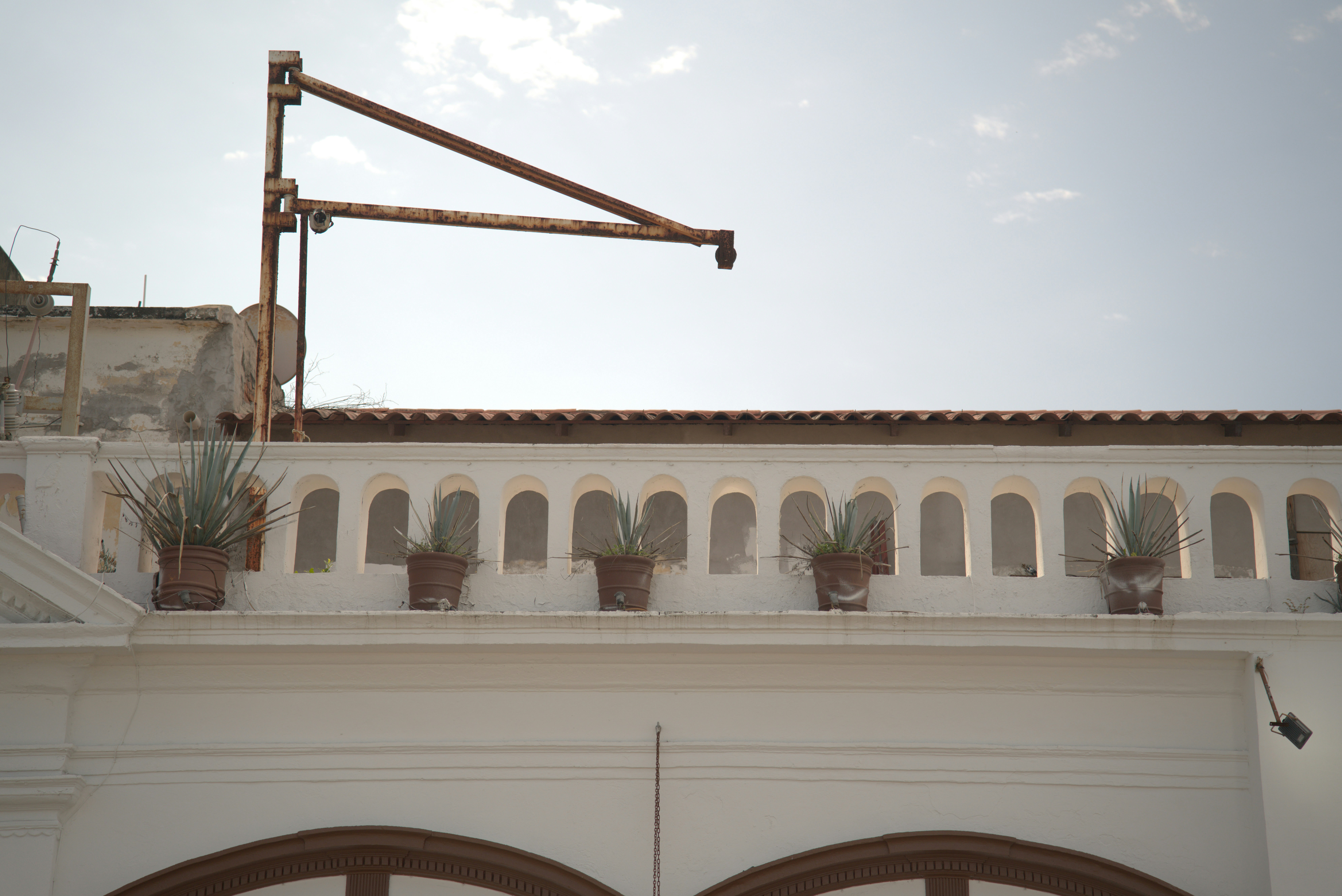 Terracotta Balcony Overhang: A Framed Classical Facade