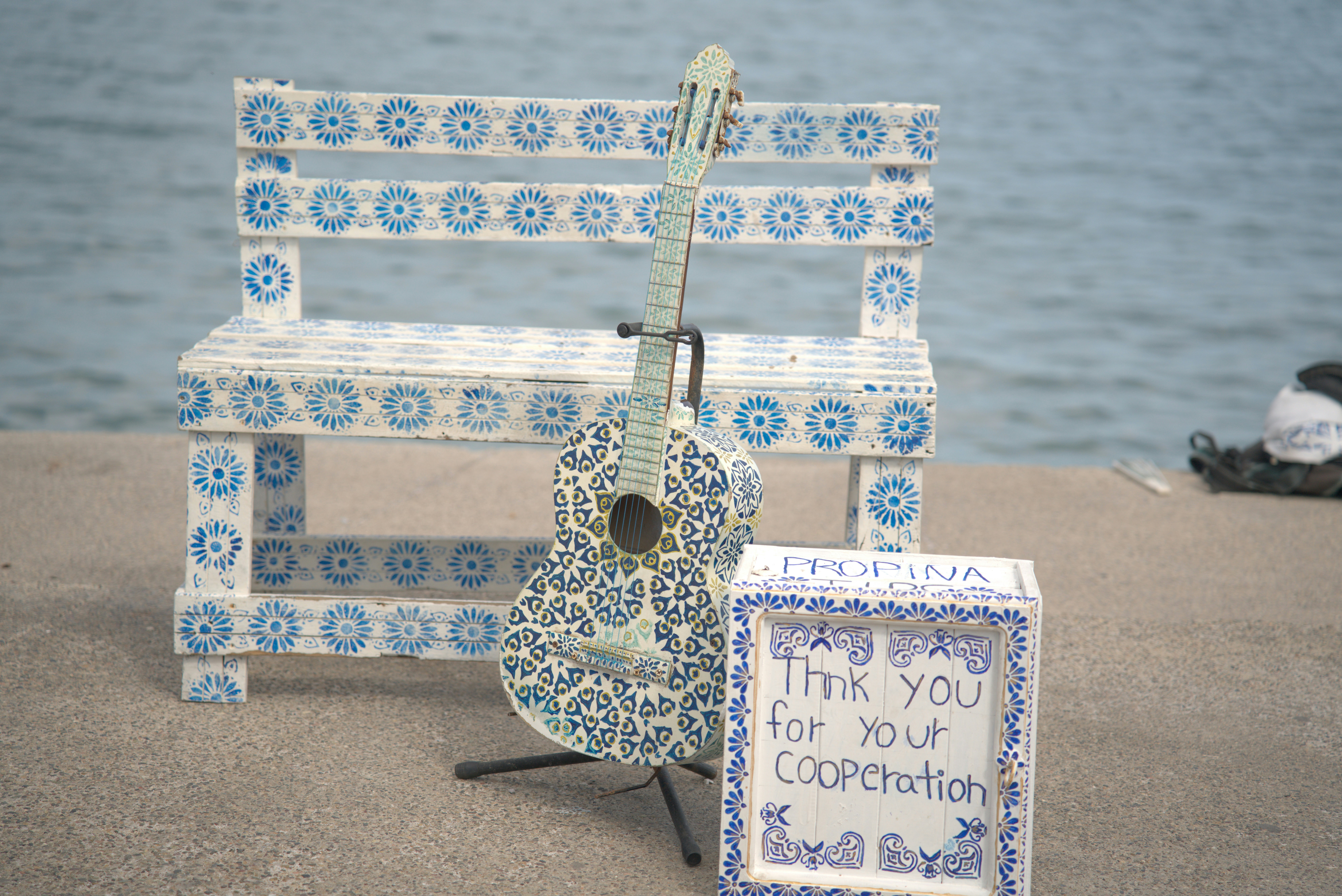 Cerulean Guitars by the Sea: A Quiet Display on the Pier