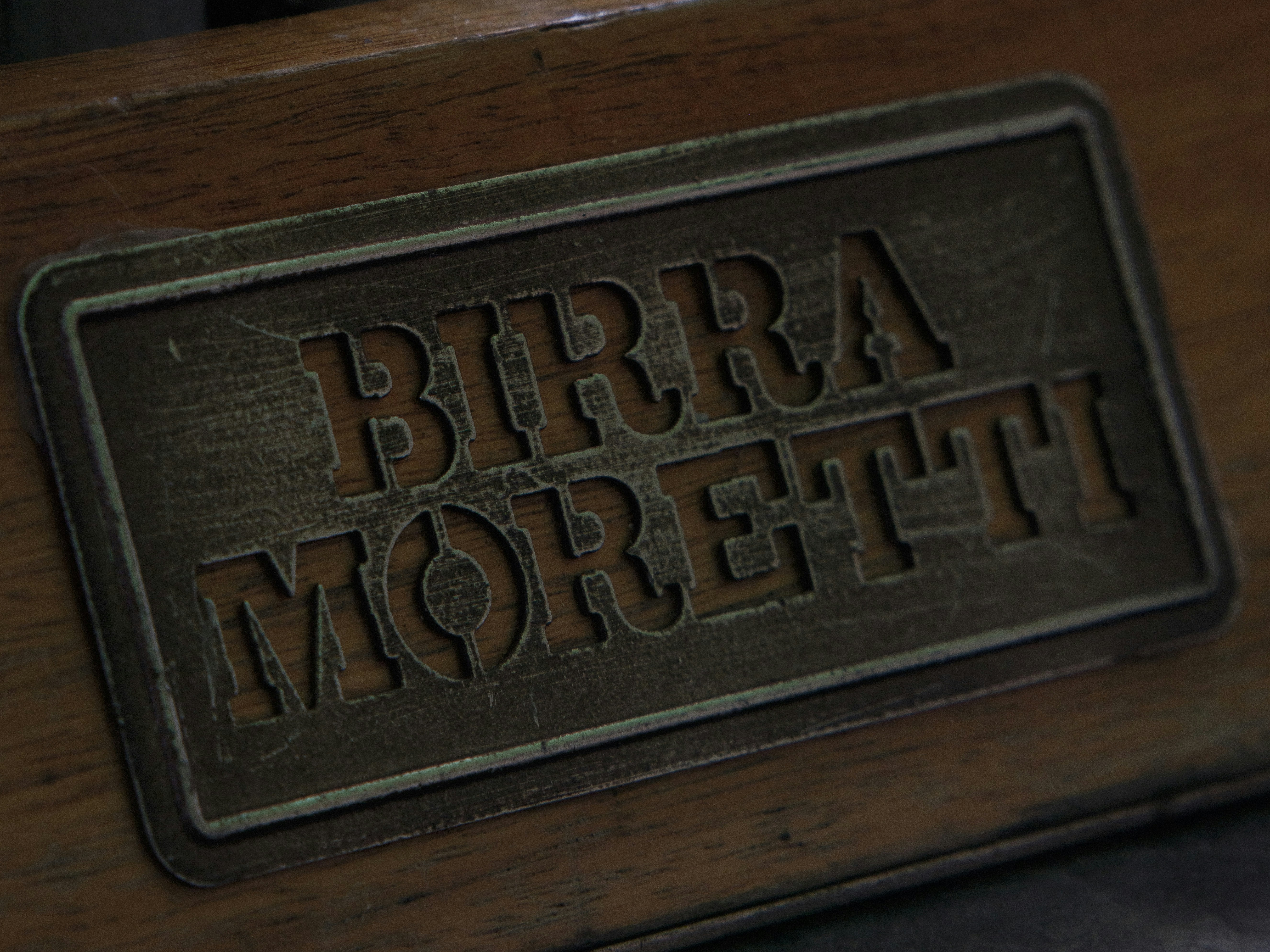 Stamped Identity: Birra Moretti on a Weathered Plaque