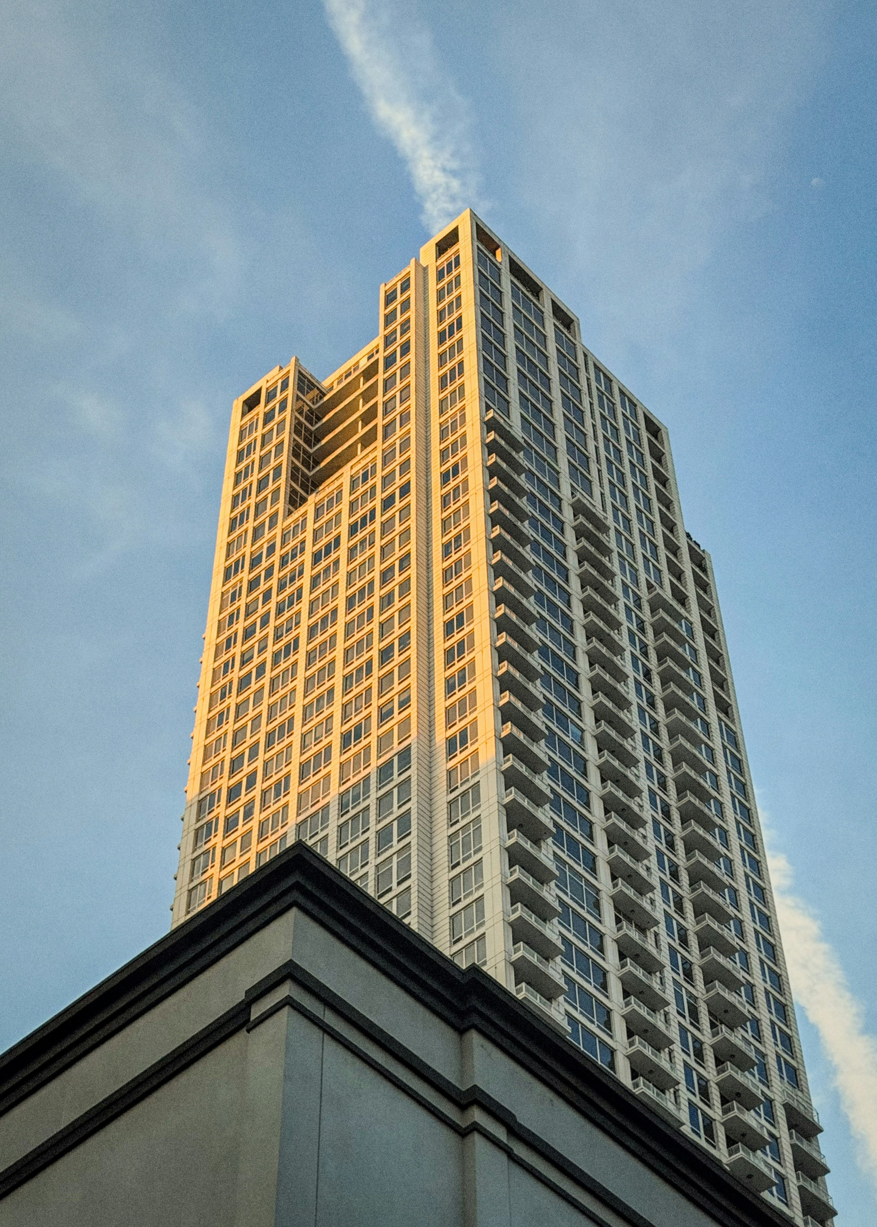 Skyward Backbone: A Sunlit Tower Reaches Toward the Sky