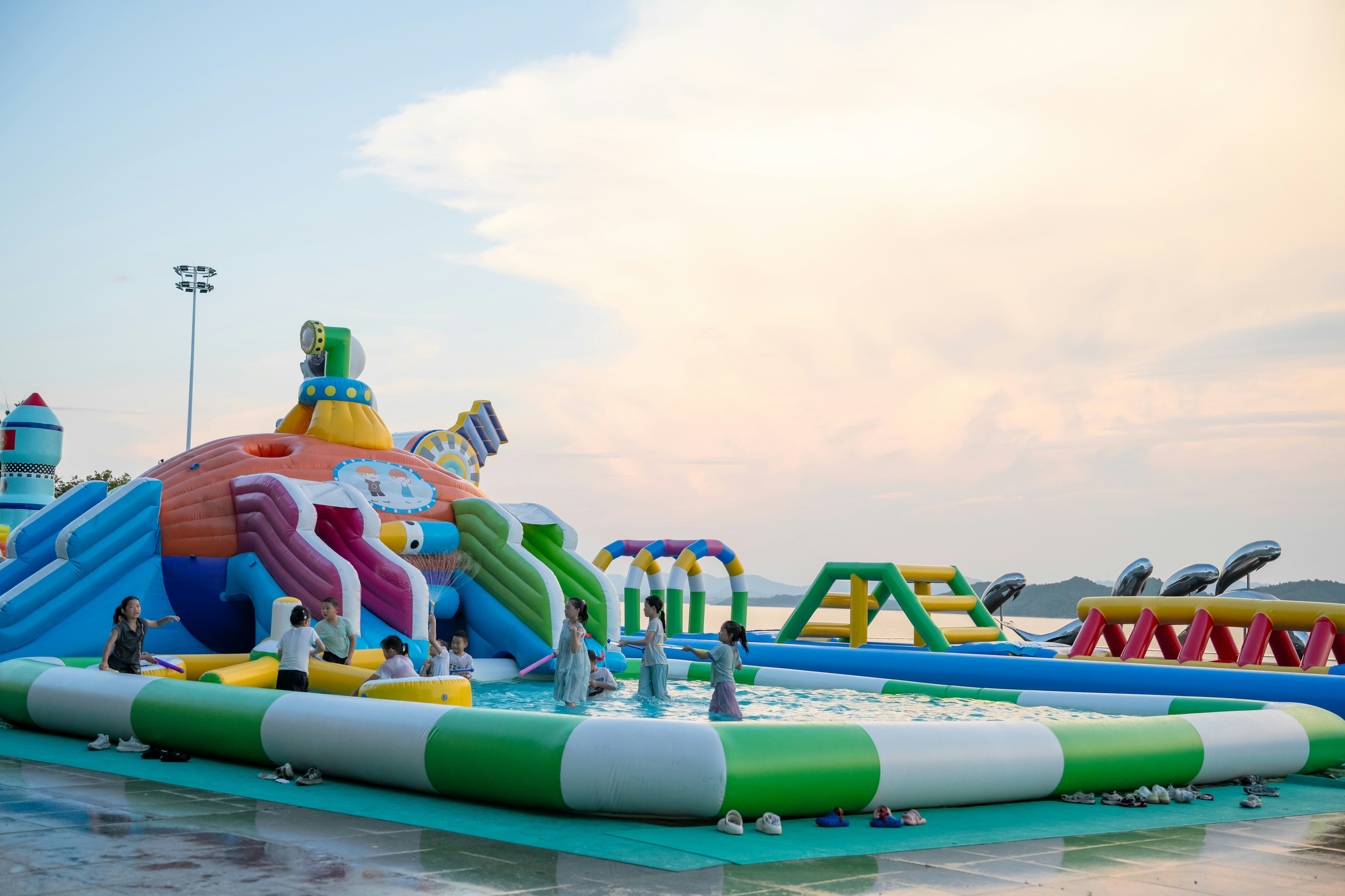 Colorful Inflatable Playground by the Sea at Dusk