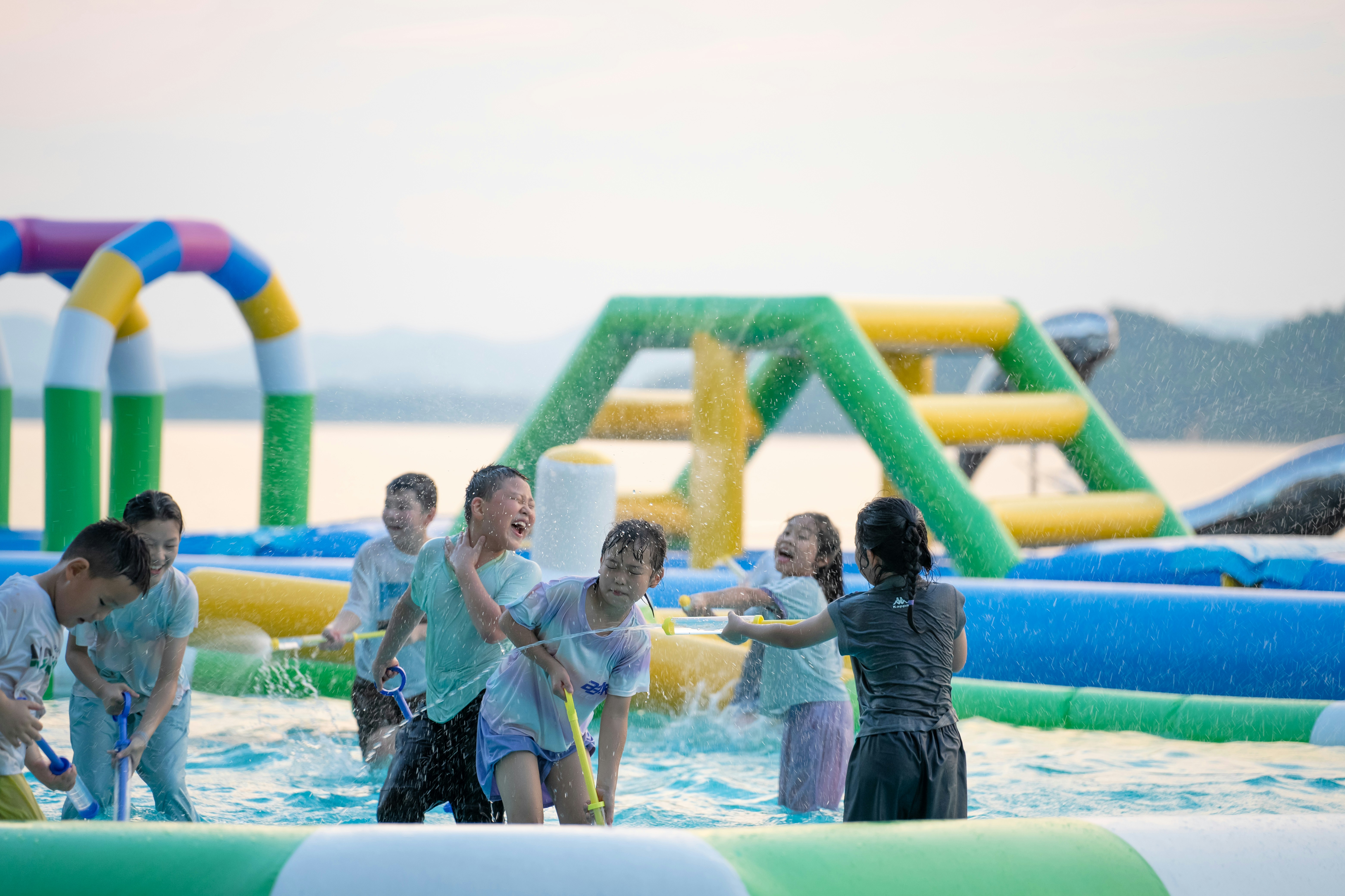Splashdown Break: Kids Revel in a Colorful Inflatable Water Arena