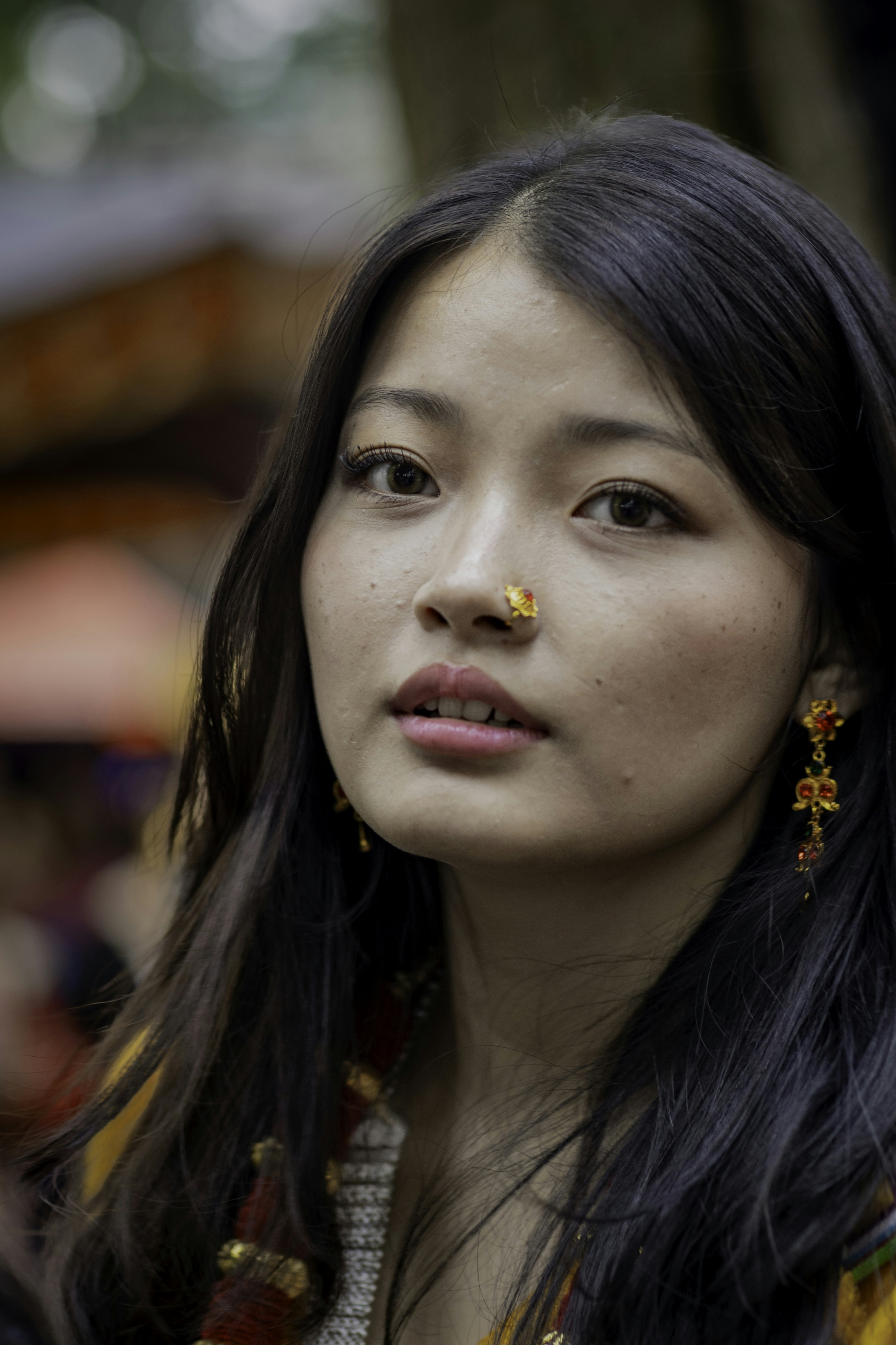 Nearing the gaze: a portrait with a delicate nose ornament