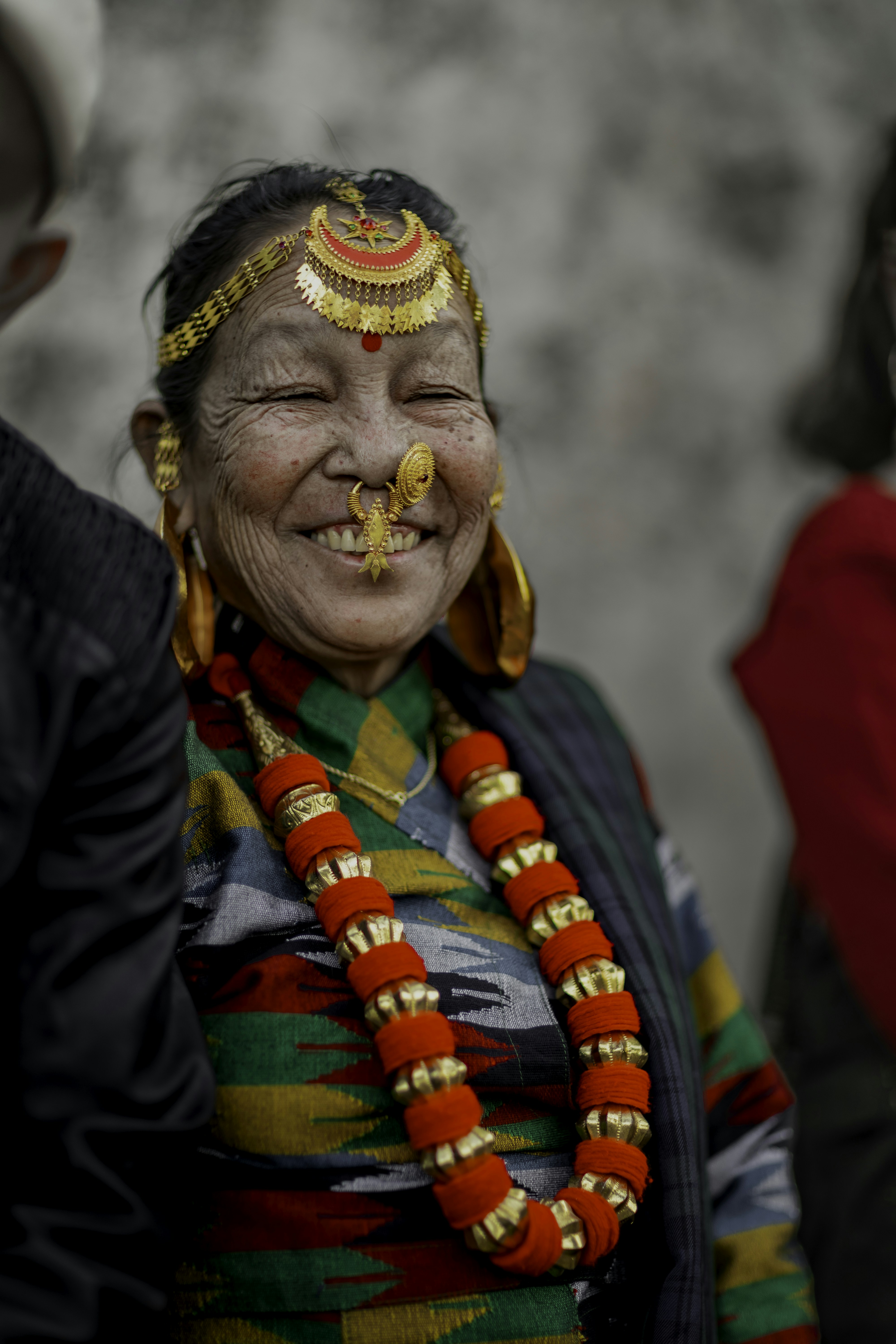 Joy in Ornament: A grandmother’s radiant smile and ceremonial gold