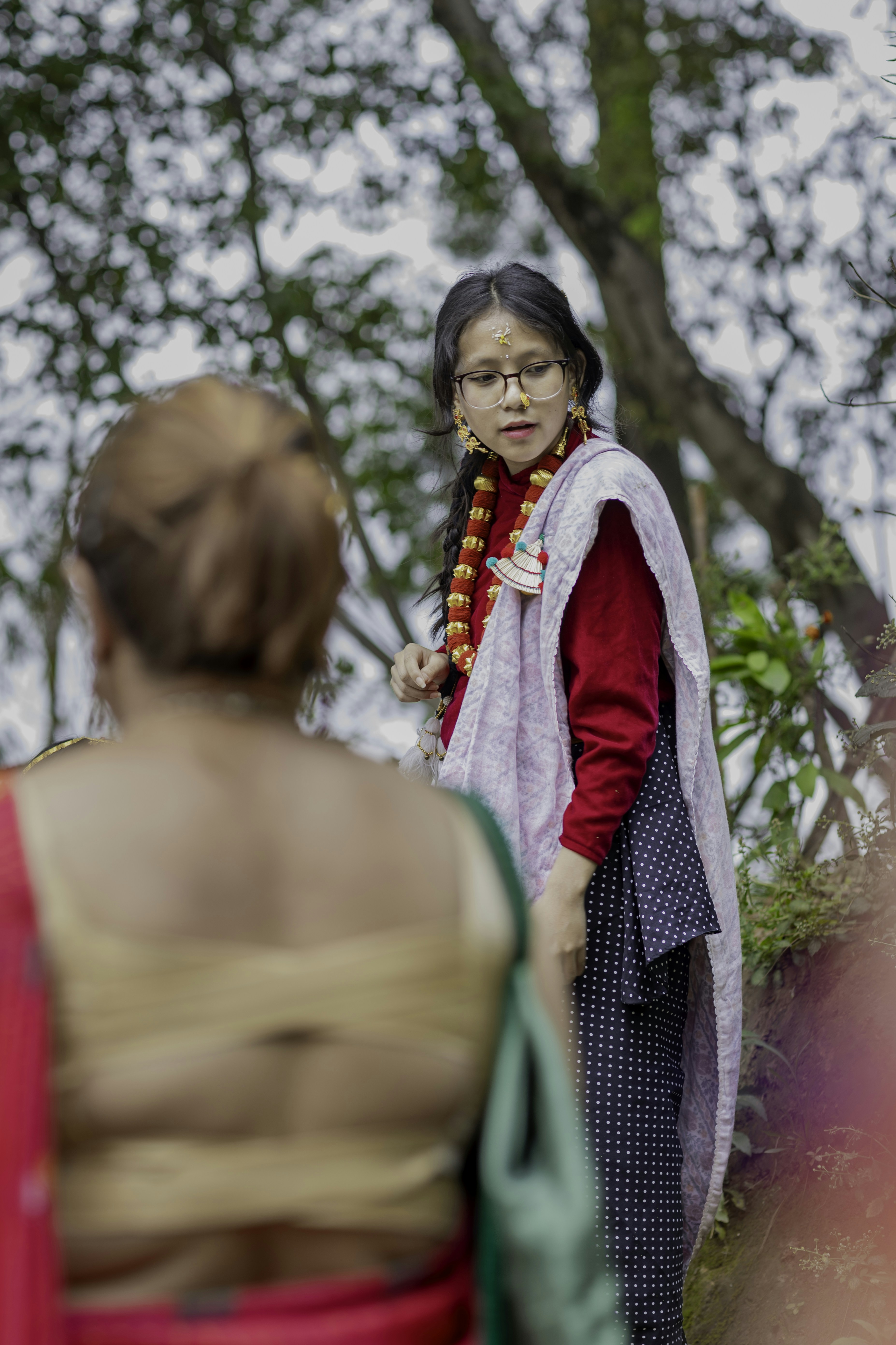 Inherited Grace: A Traditional Attire Moment Under Open Sky