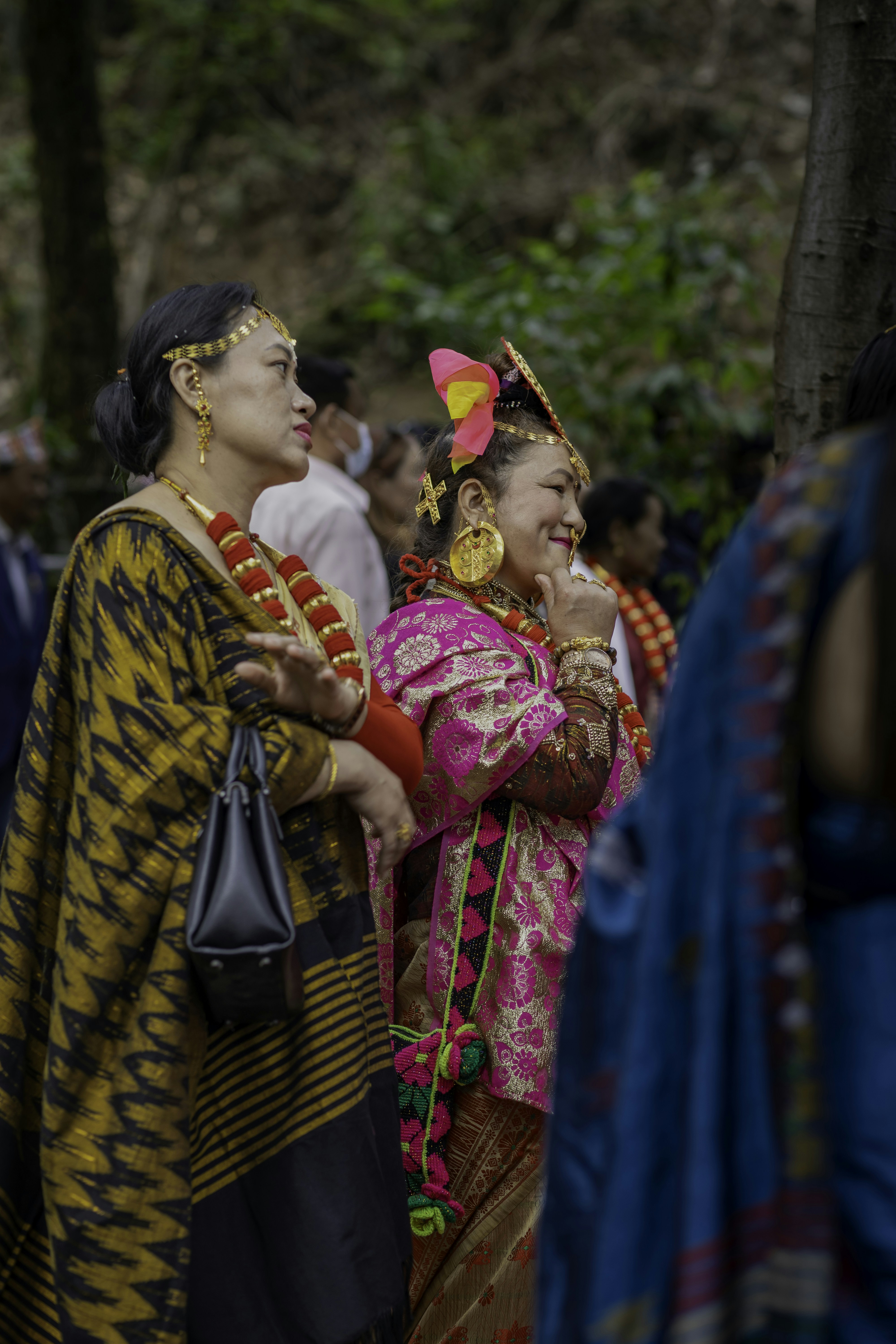 Colorful Ceremony: Two women in traditional attire at a festive event