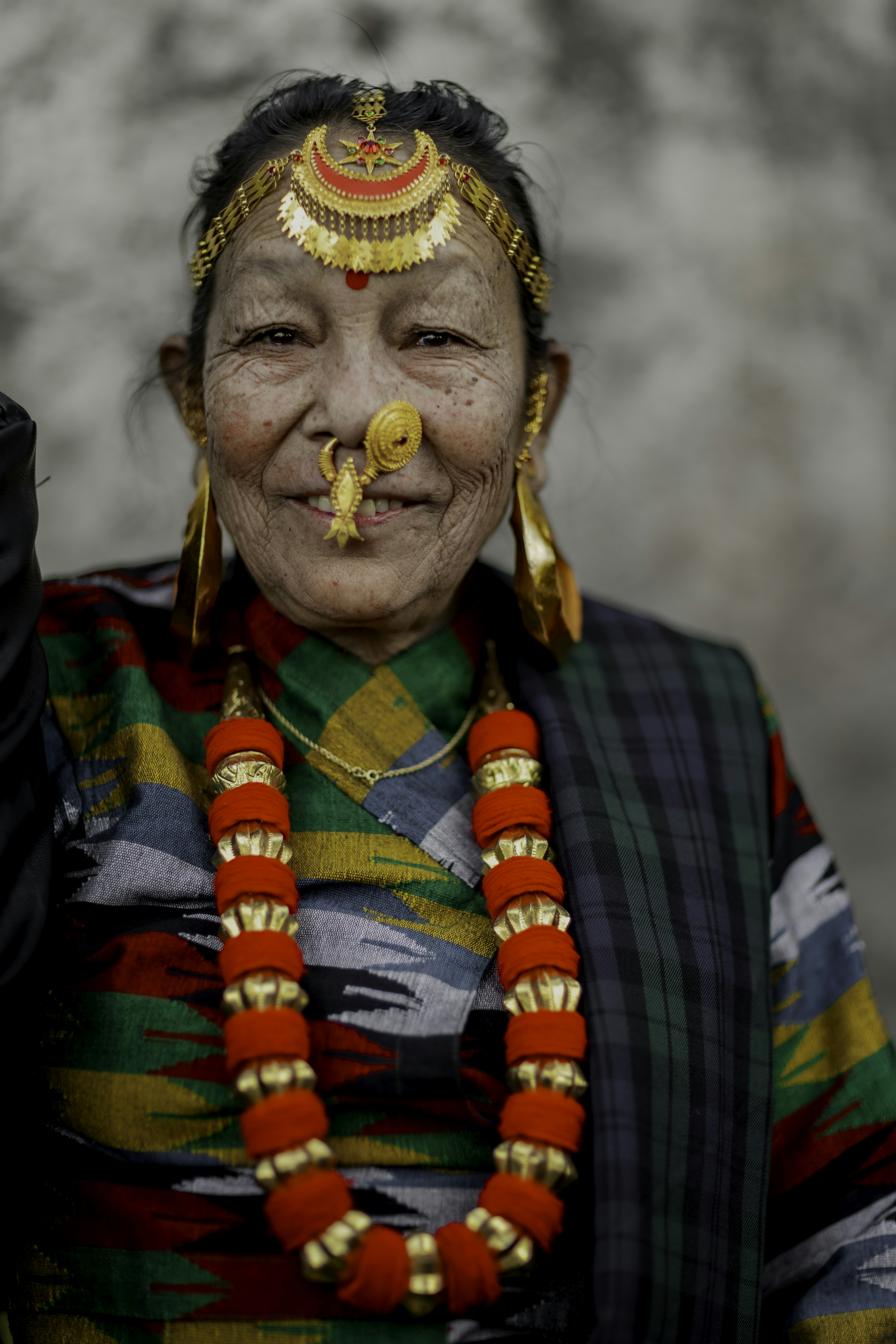 Adornment and Smile: A Nepalese Eldress in Rich Garb