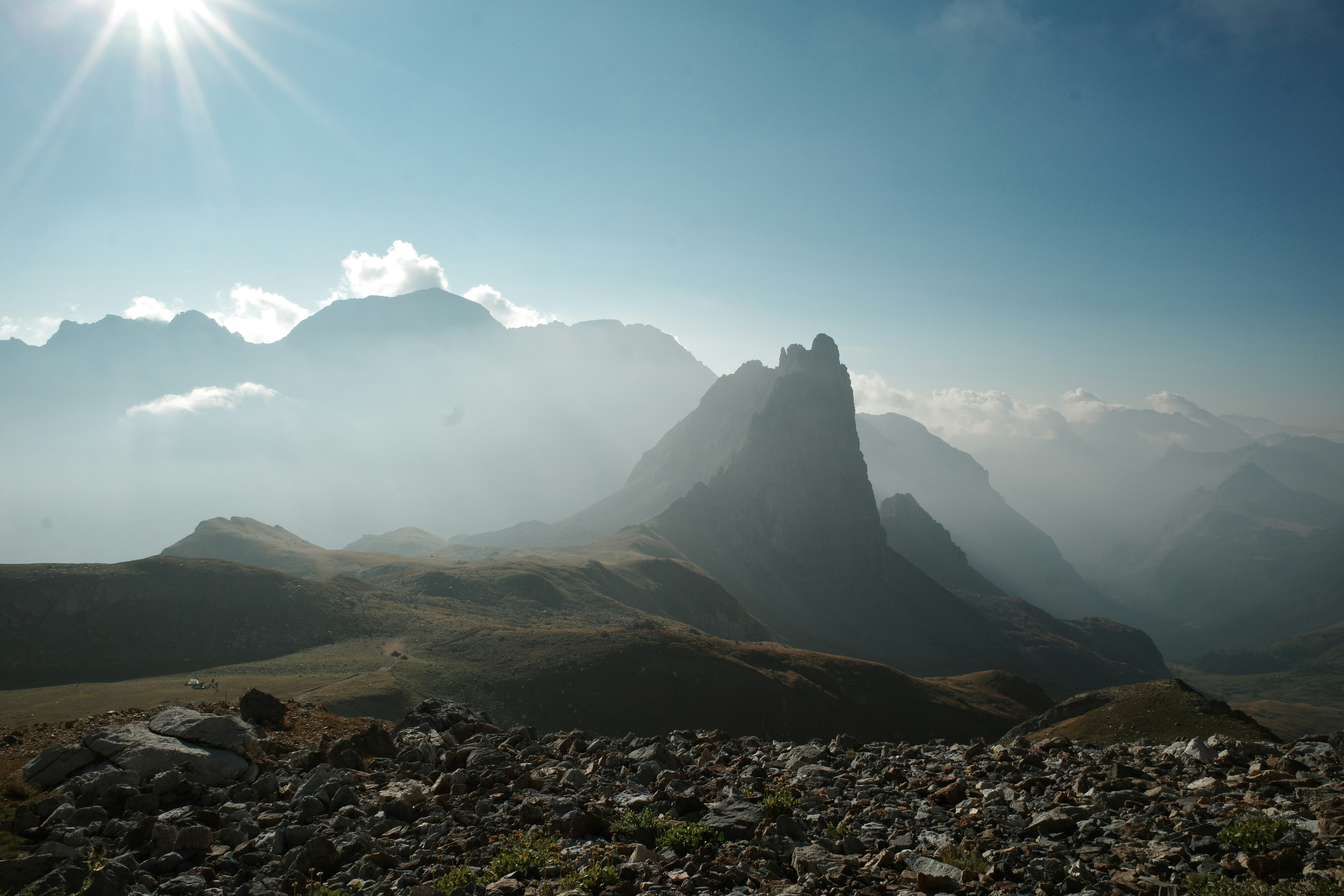 Ridge Sentinel: The Peak Piercing Through Morning Mist