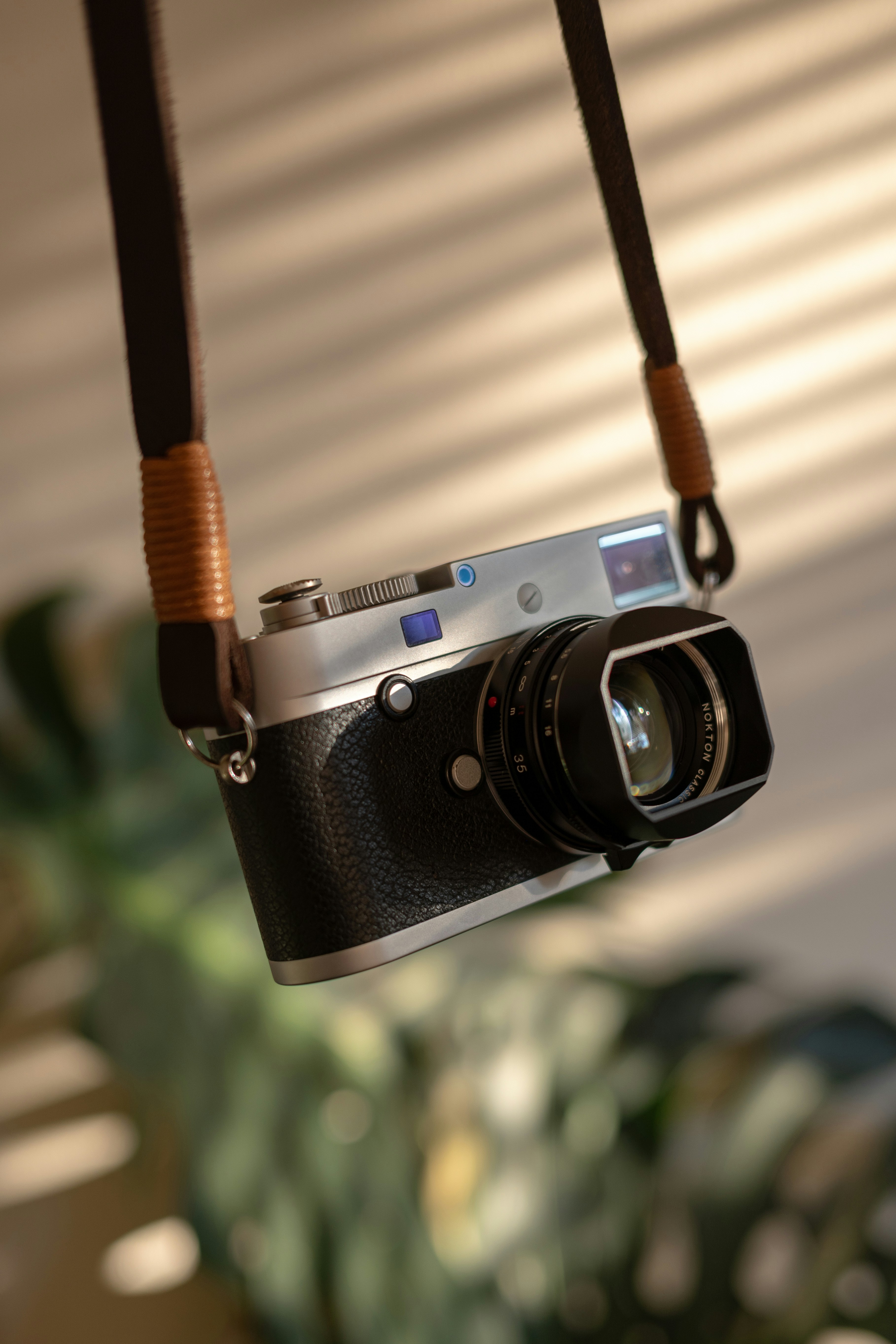 Suspended Silver Mirror: A Retro-Style Rangefinder in Focus