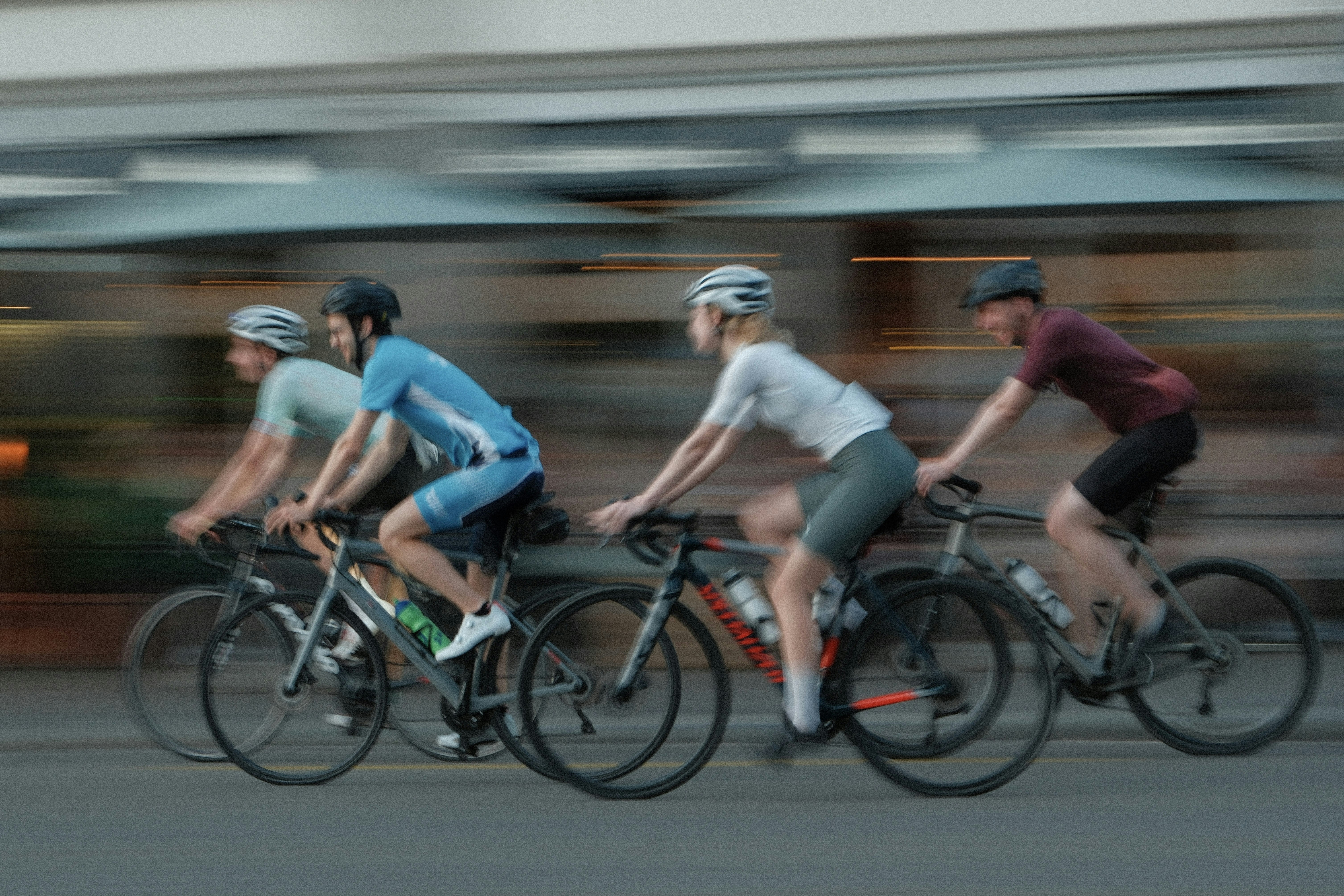 Blurred Cadence: A Pack of Cyclists in Motion