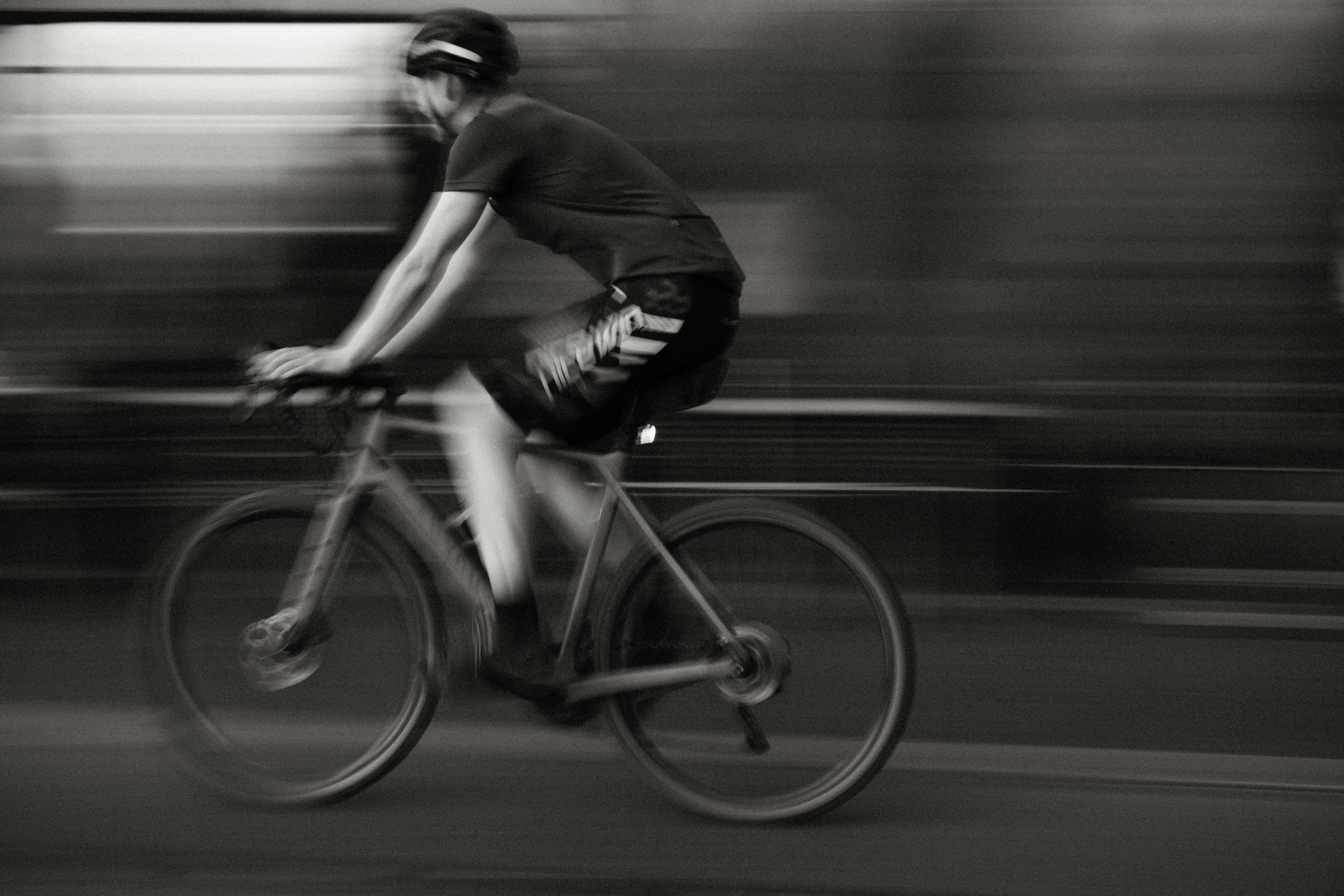 Blurry Pursuit: A Cyclist in Motion Blur Across the City