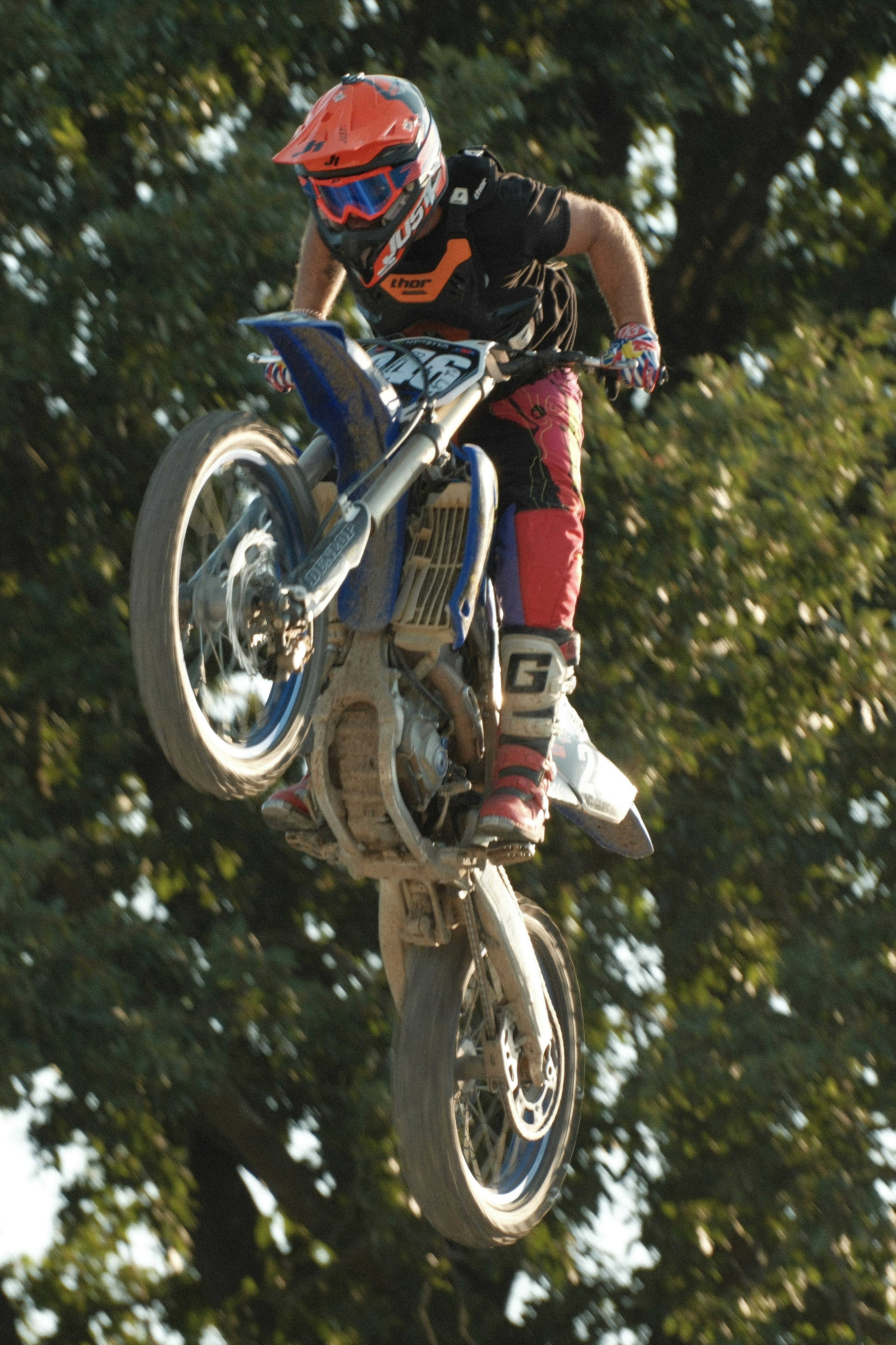Mid-Air Breakaway: Rider Flies Over a Dirt Jump