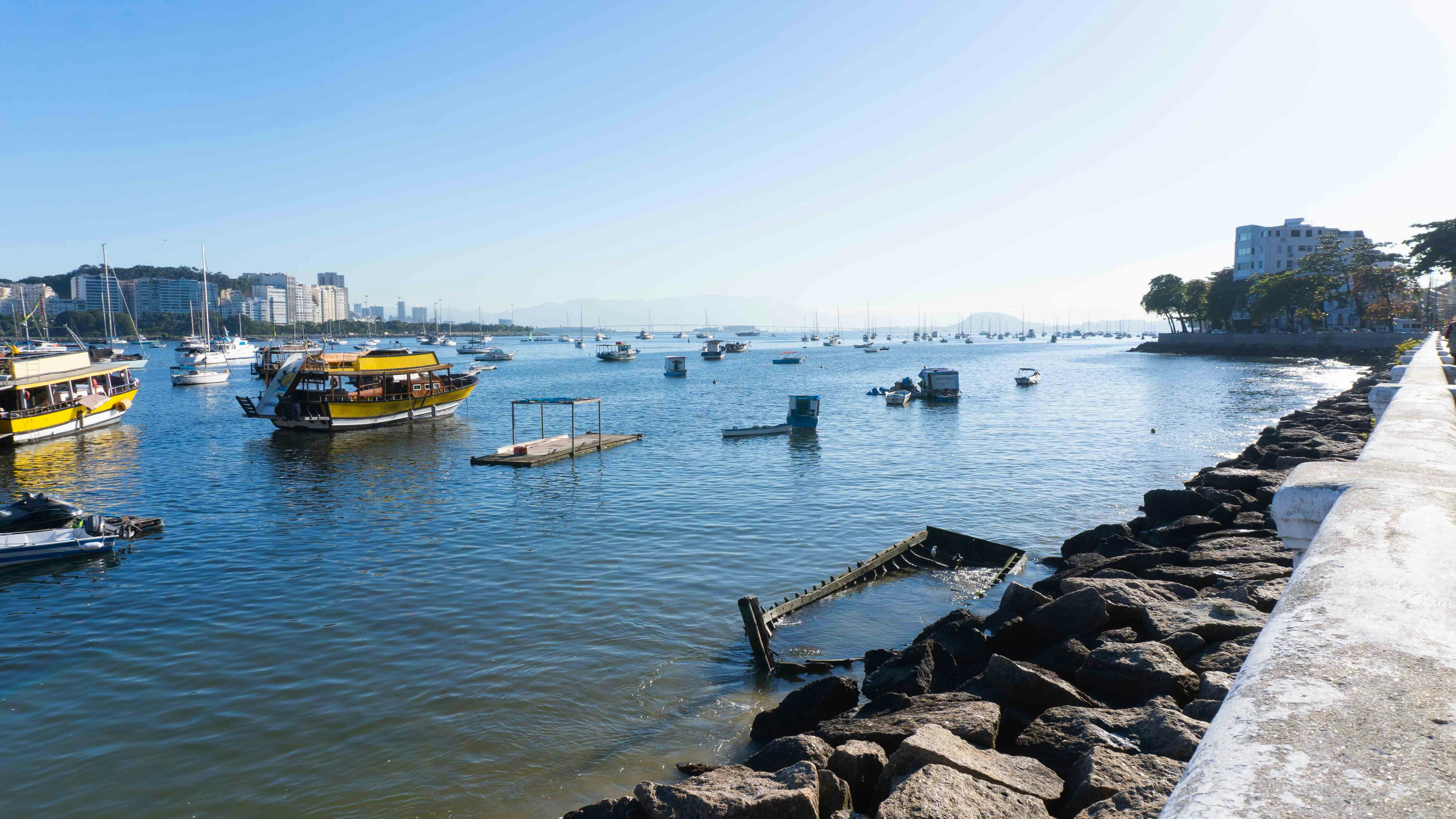 Harbor Calm: Boats Nestle Along the Lomg Breakwater at Dawn