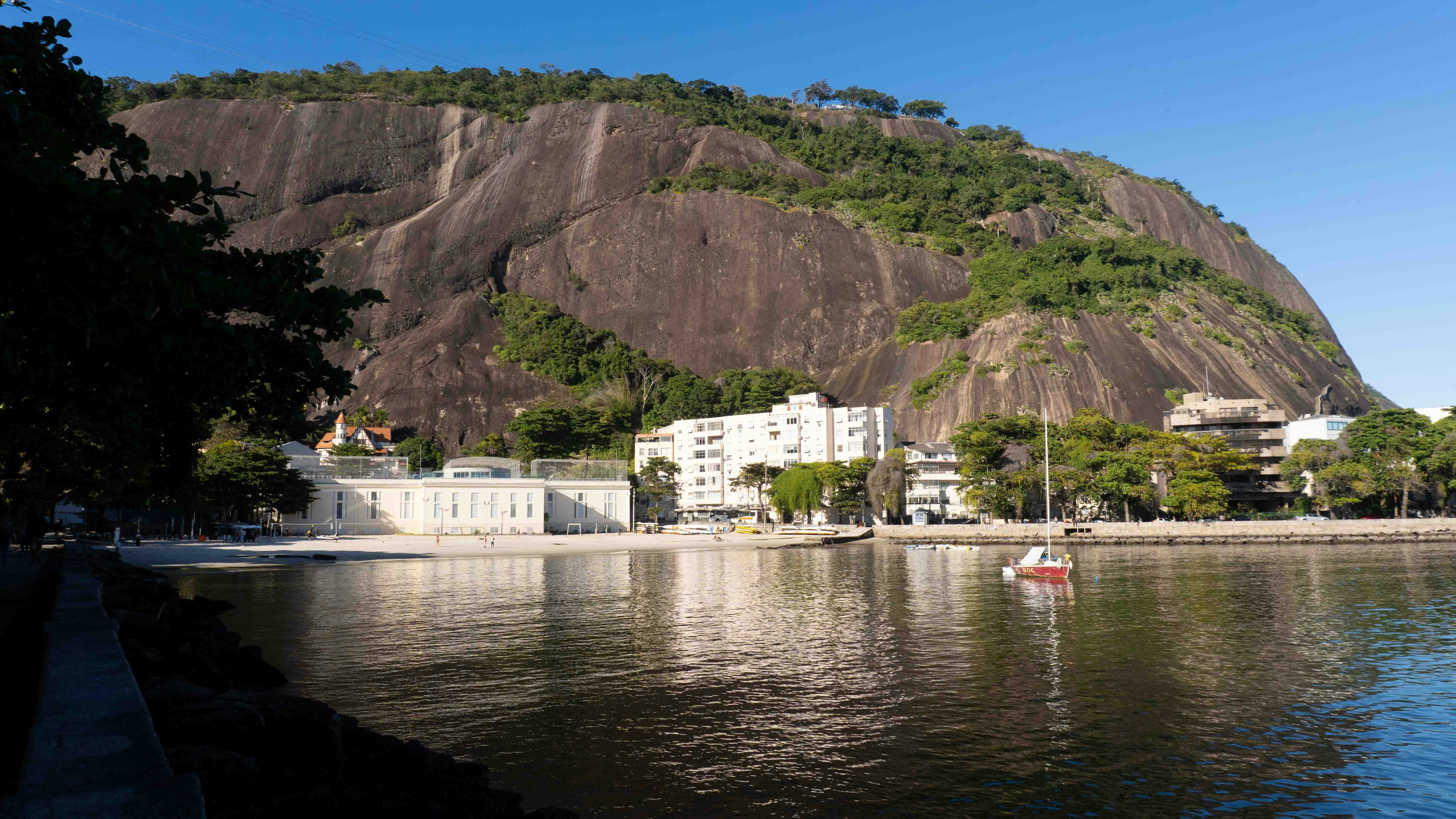 Harbor Under the Cliff: White Buildings at Water’s Edge