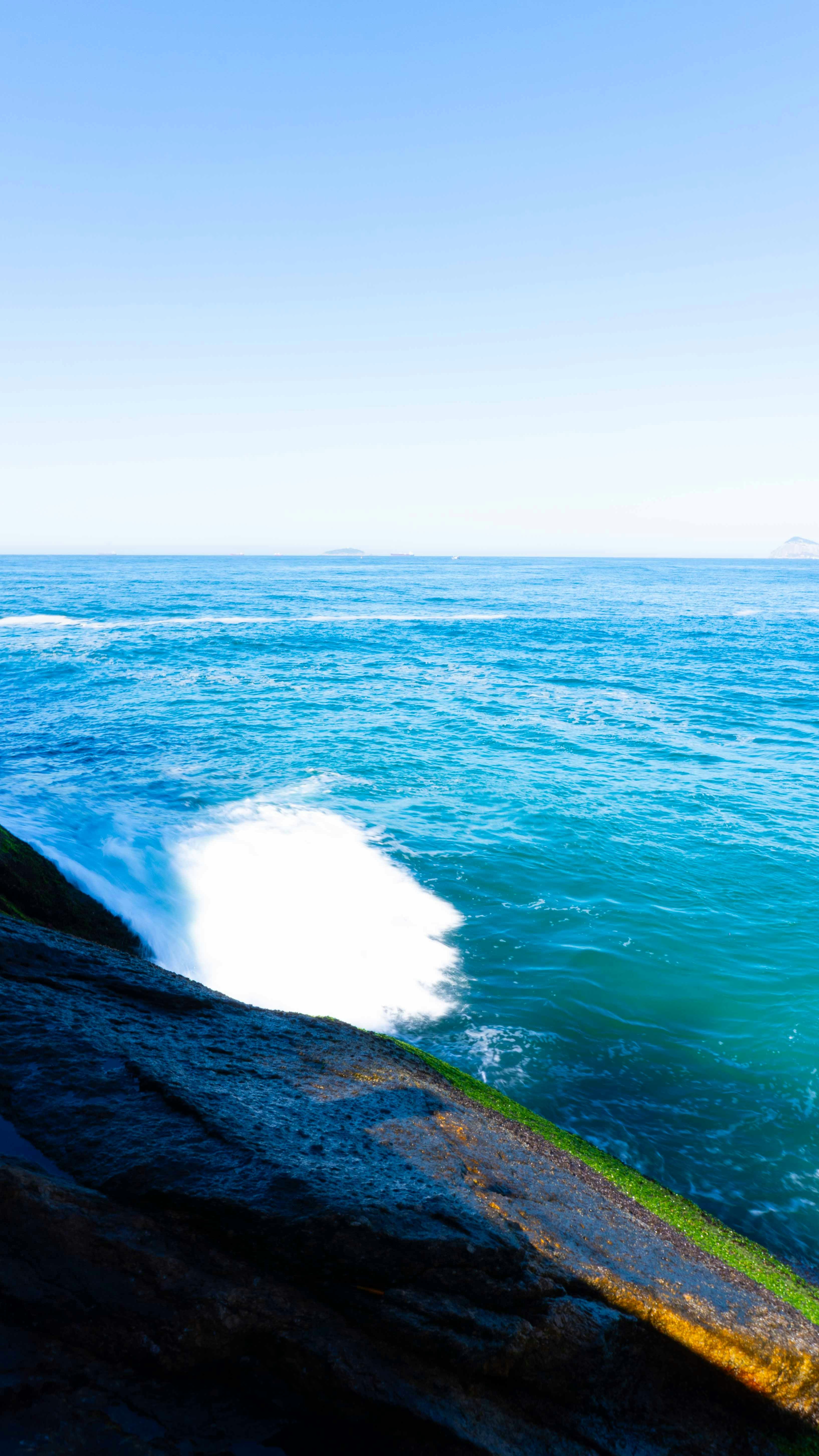 Sea Spray over the Quiet Edge: A Ledge Meets the Atlantic Horizon