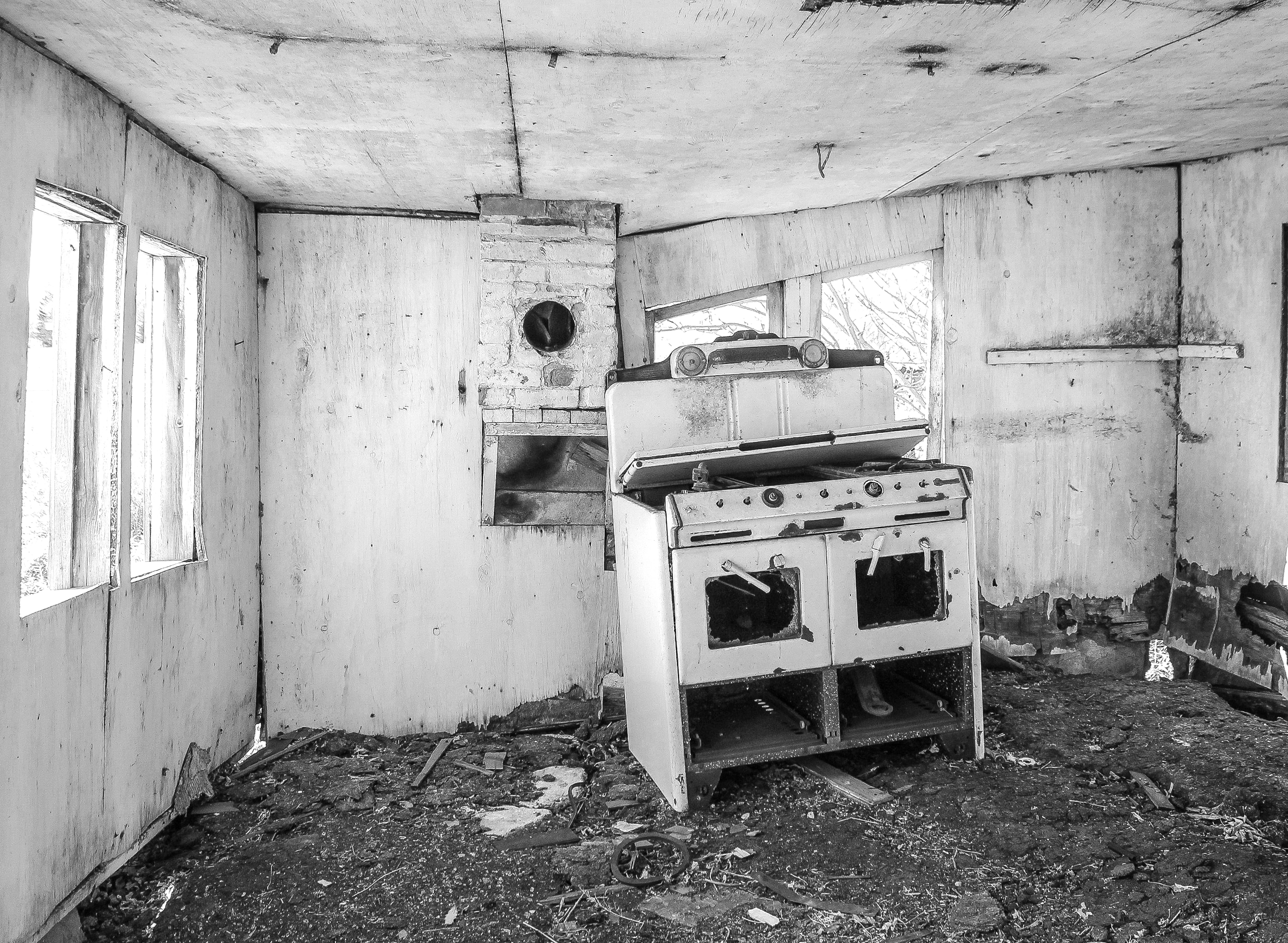 Abandoned Kitchen Shrine: A Stove Among Ruins