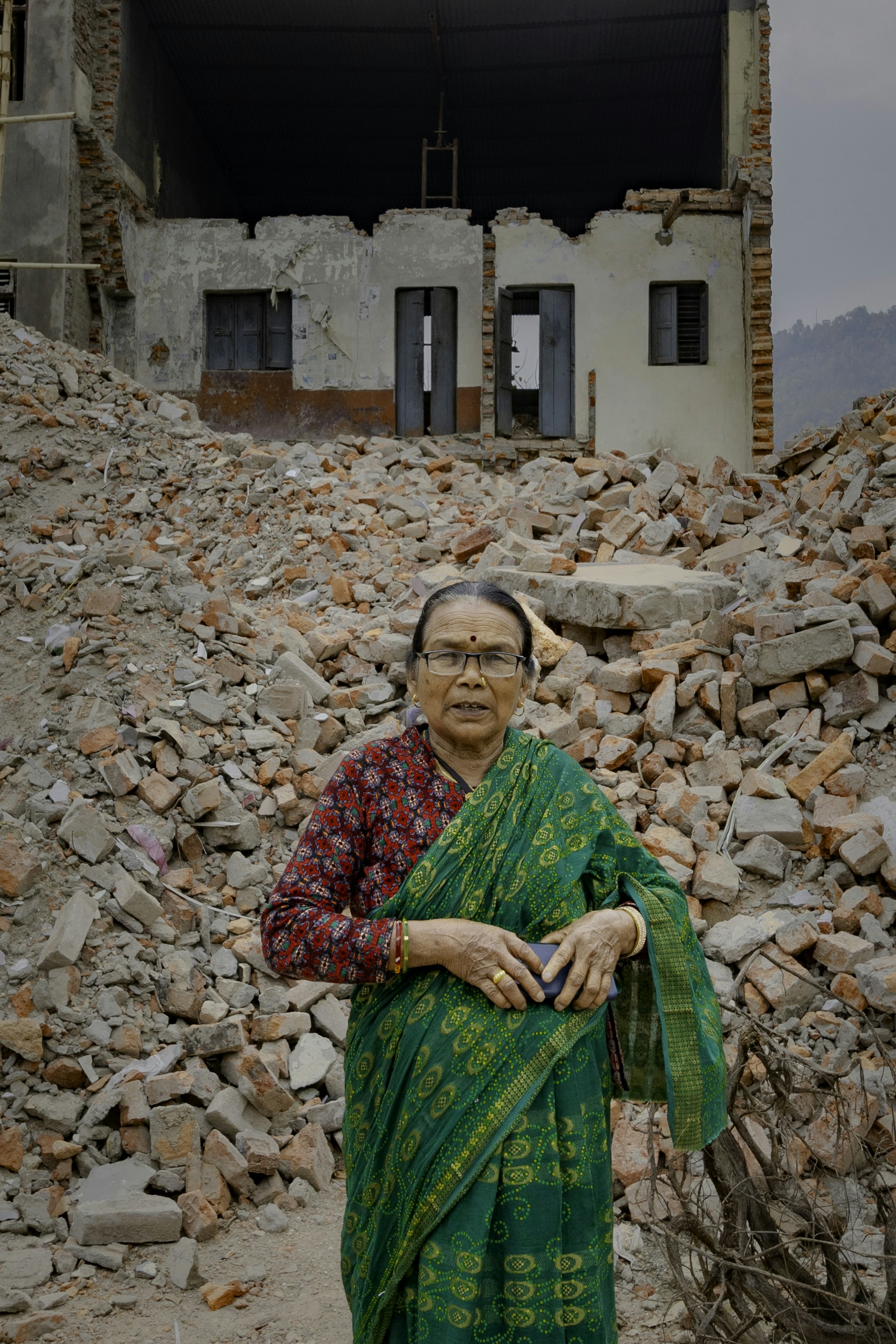 Resilient Elder in a Ruined Terrace