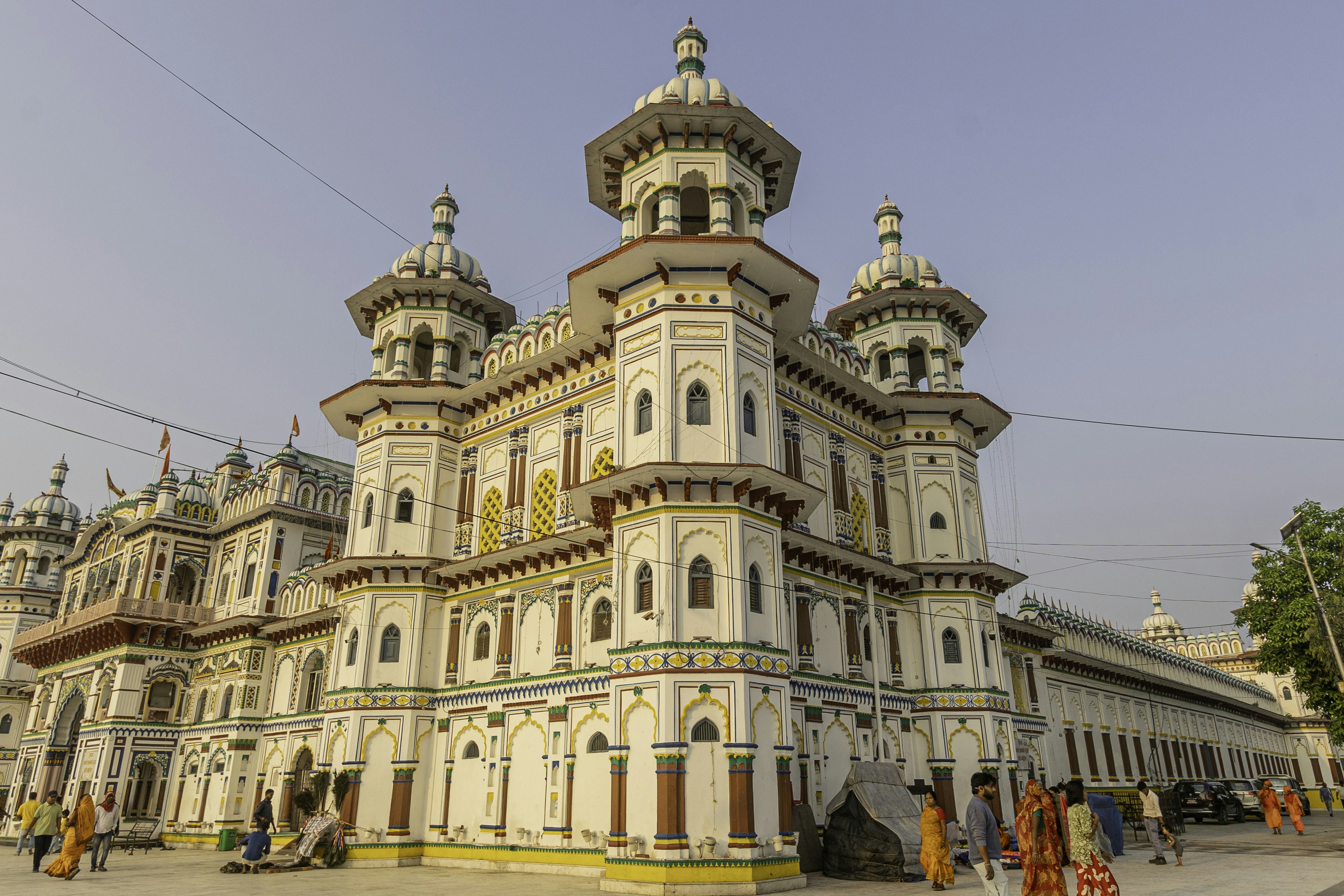 Ornate Temple Facade Rising Across a Sunlit Plaza