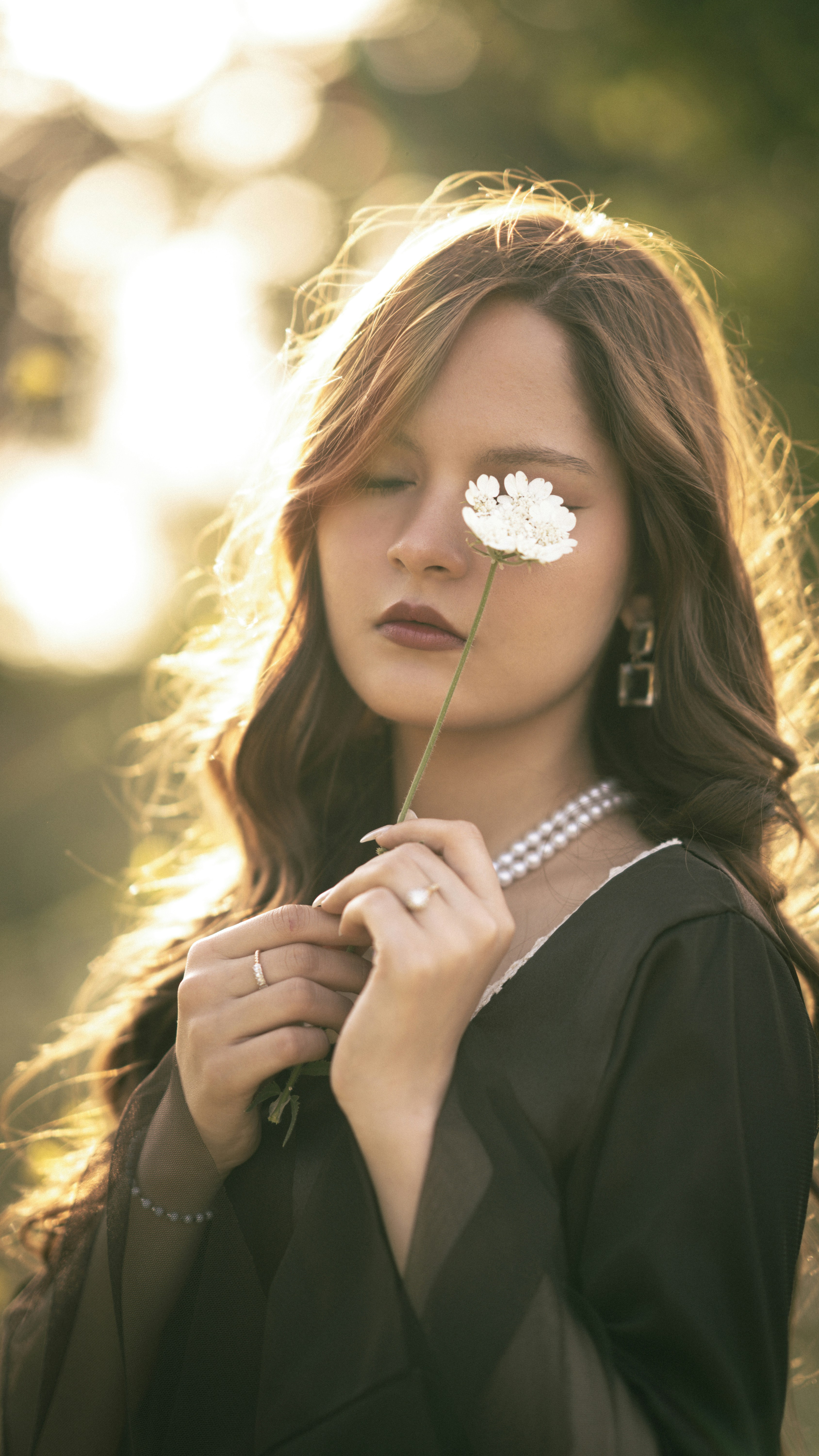 Soft-gold Portrait: A Flower Between Veiled Gaze and Evening Light