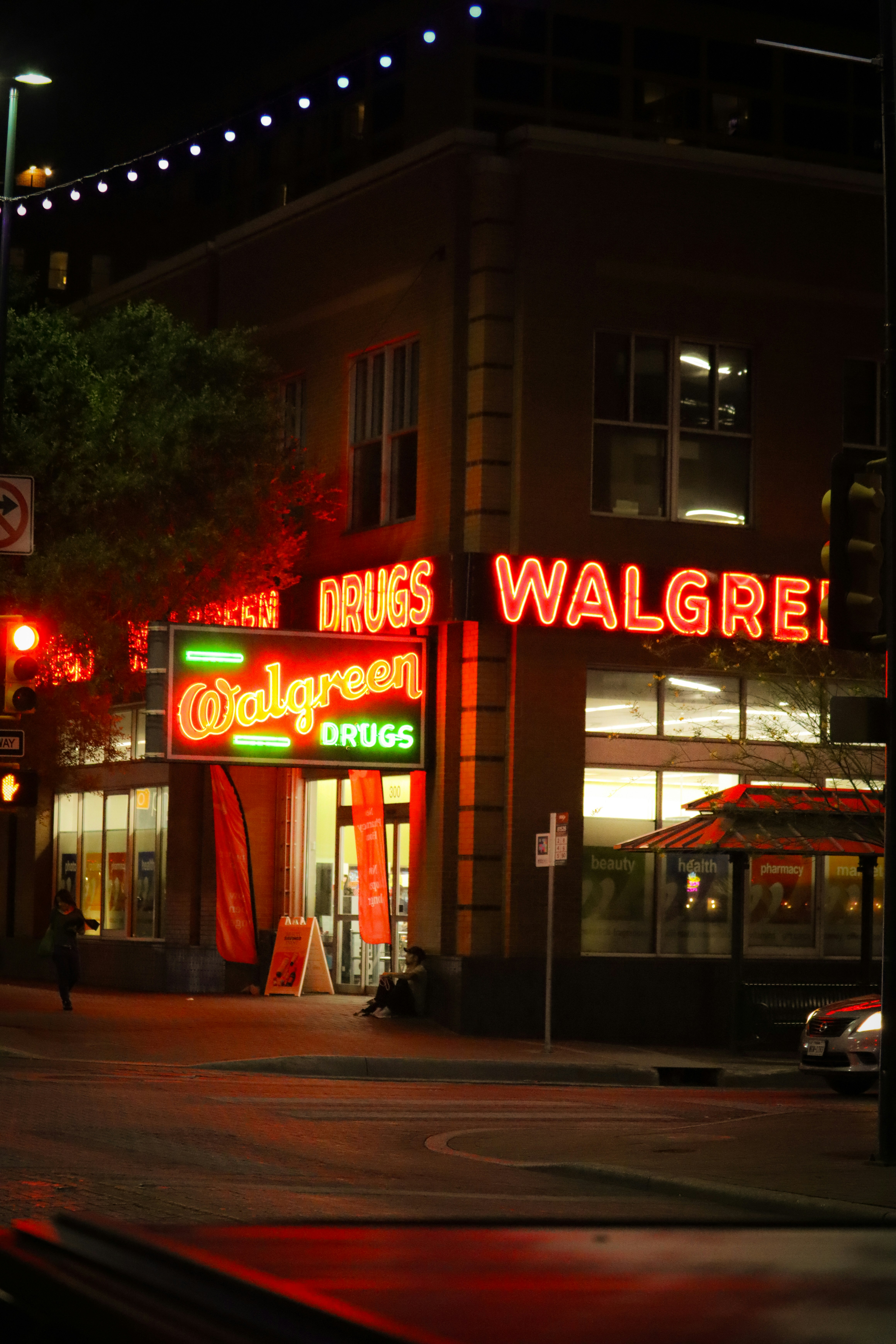 Neon Pharmacy at Night: Walgreen’s Glow Through a Quiet Street