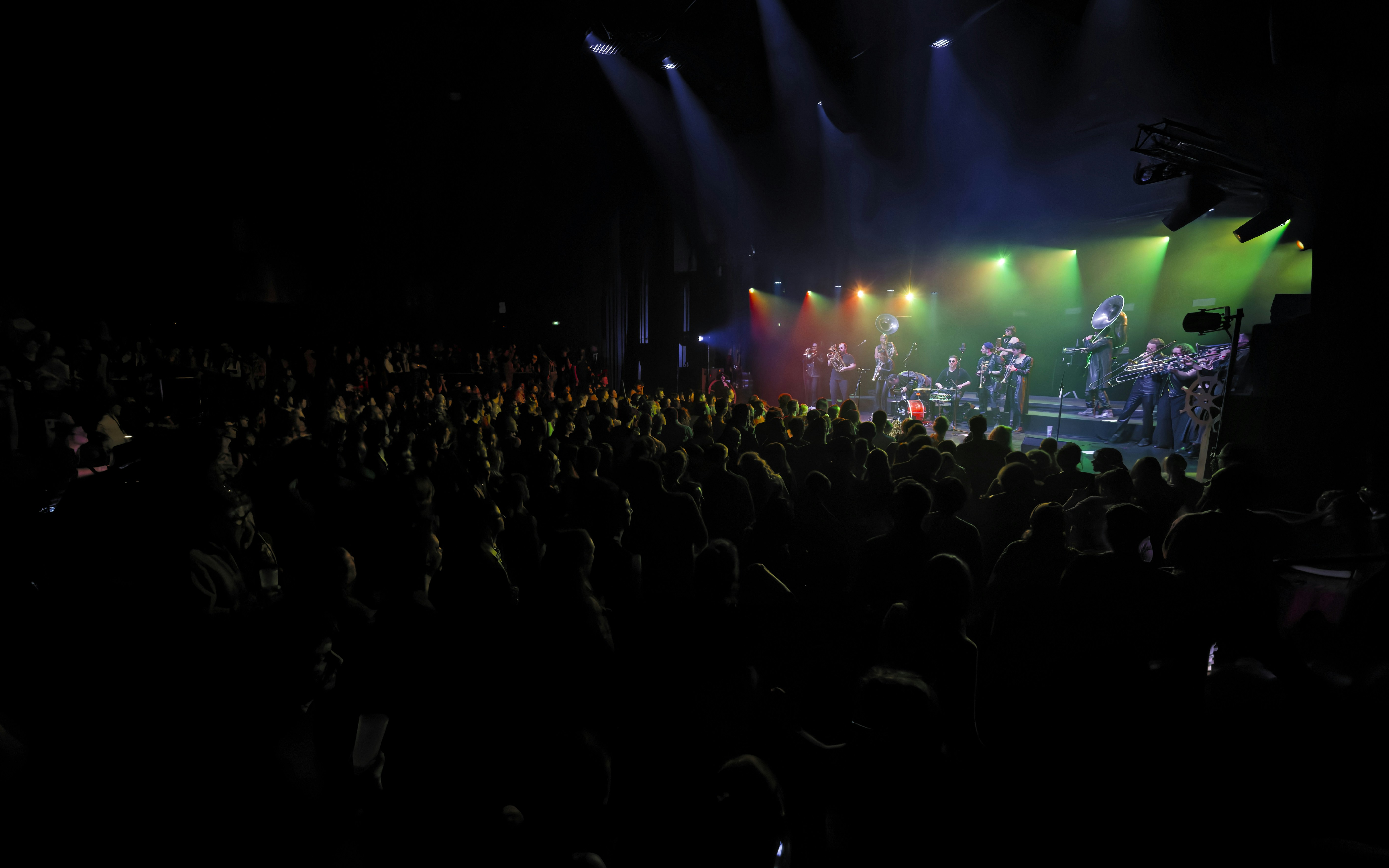 Rainbow Spotlight: A Live Band Ignites a Darkened Theater