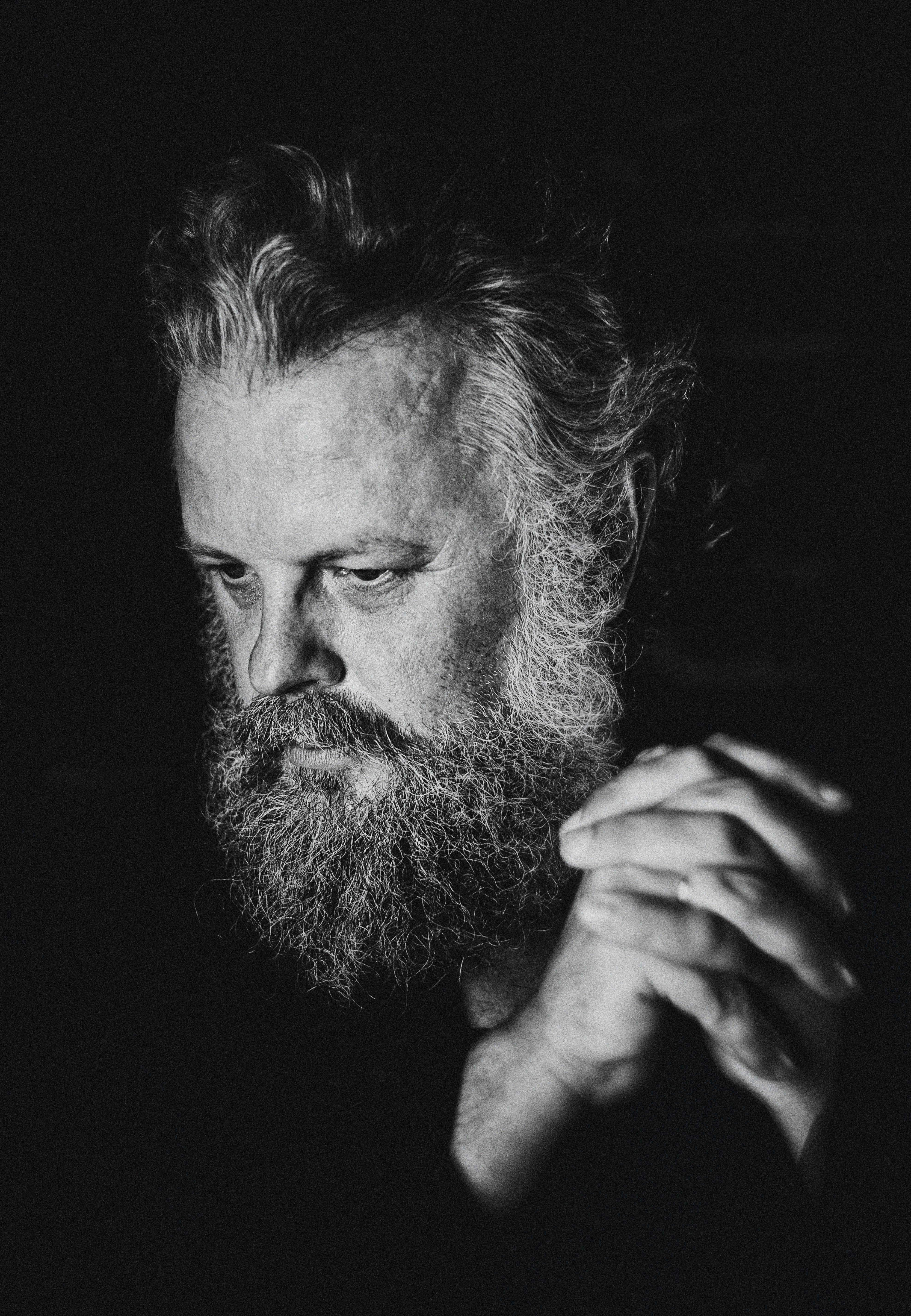 Quiet Gravity: A Contemplative Portrait in Deep Shadow