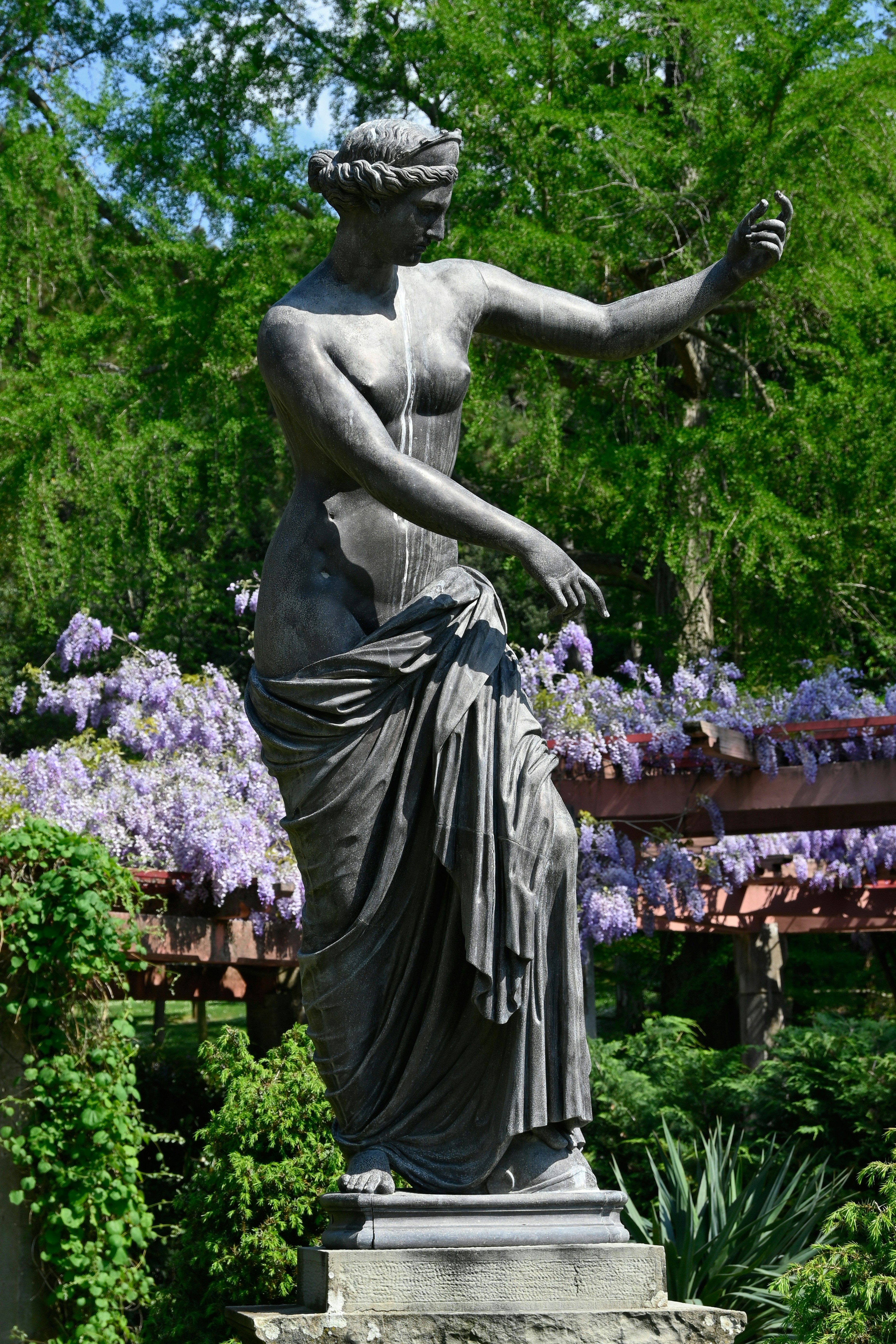 Statue of a Draped Goddess Reaching Toward Floral Terrace