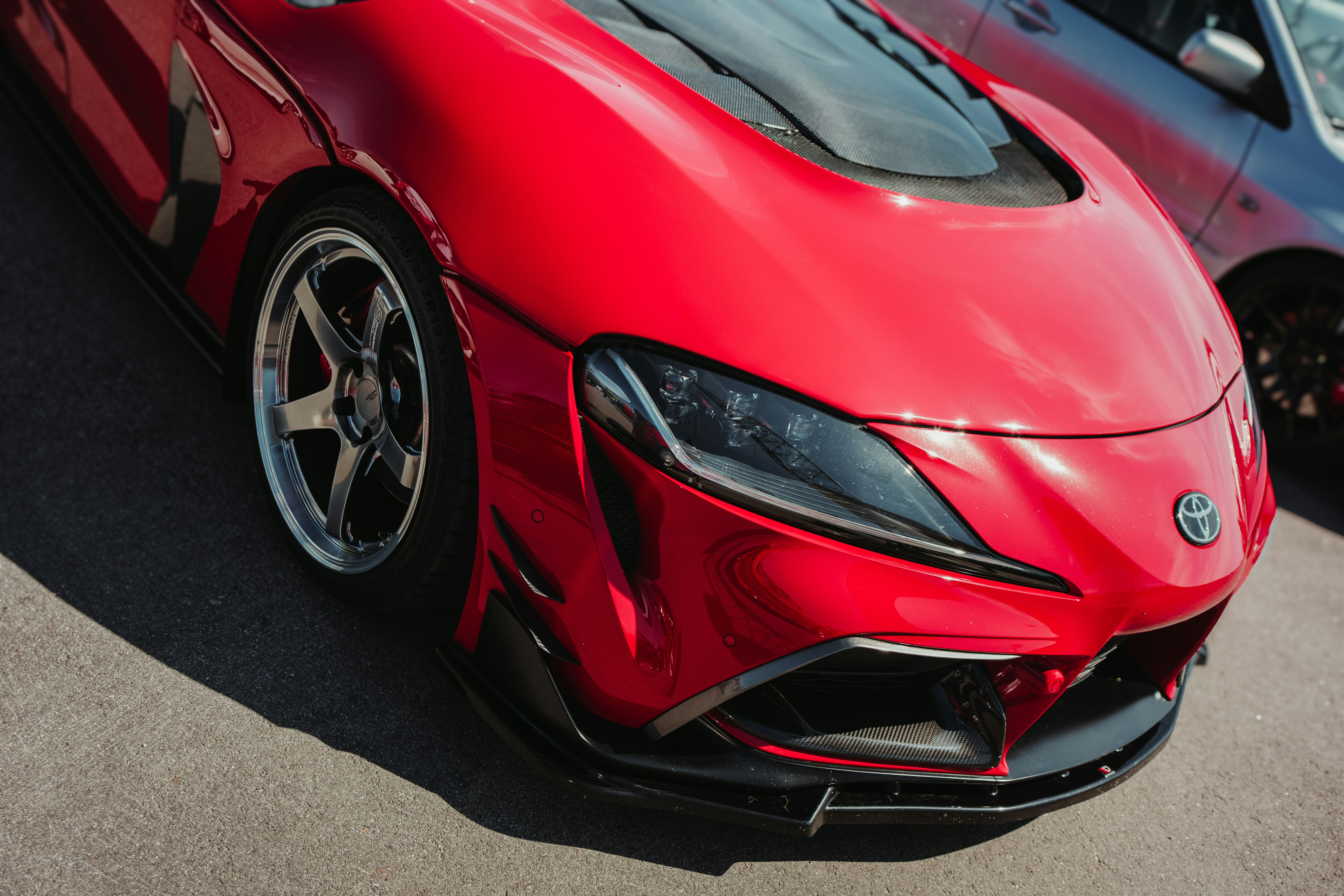 Aggressive Red: Front-Quarter of a Touched-Up Sports Sedan