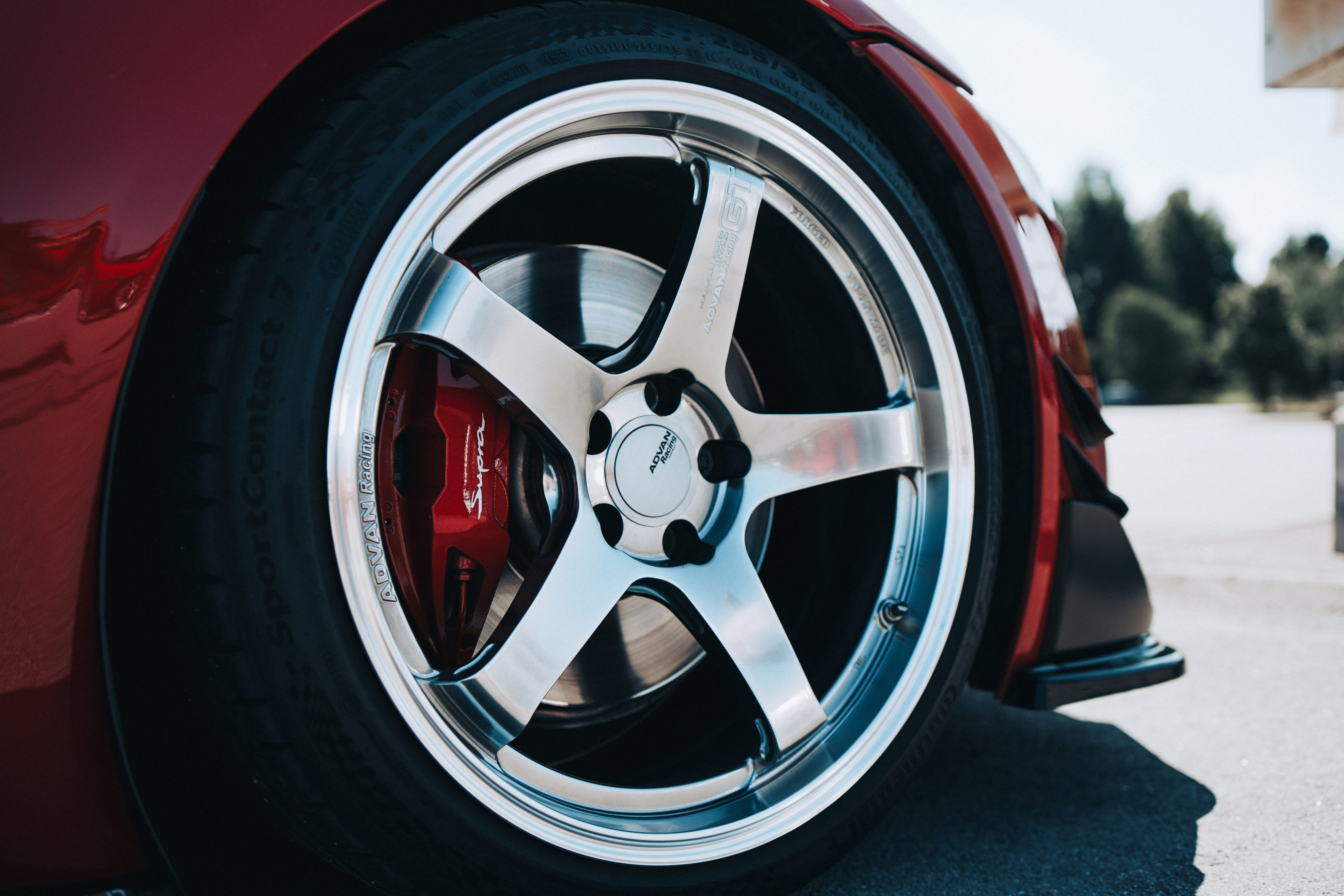 Red Torque: Close-Up of a Shining Alloy Rim