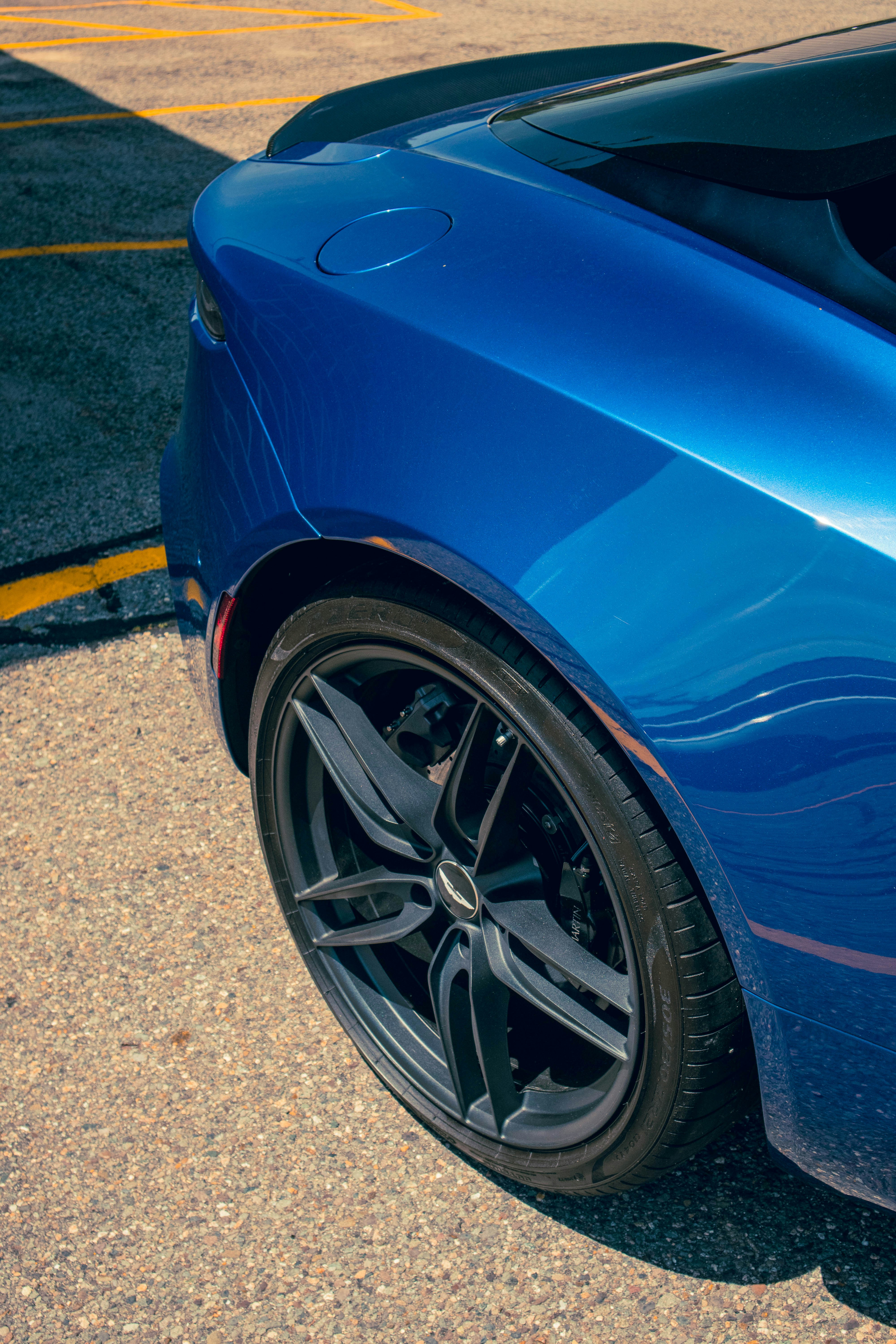 Blue Corvette Curve: A Glimpse of Power and Pinstripe